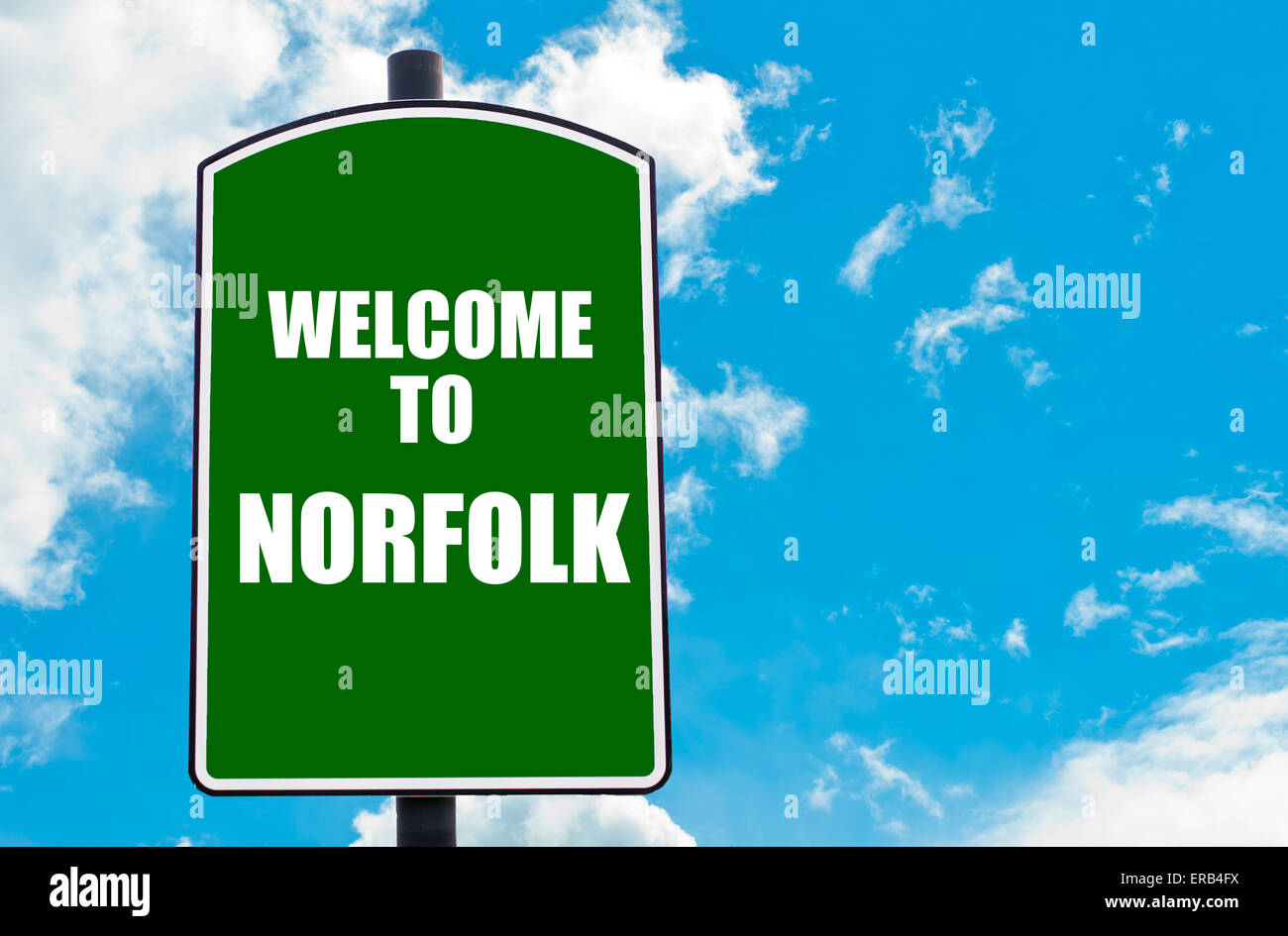Green road sign with greeting message WELCOME TO NORFOLK, ENGLAND ...