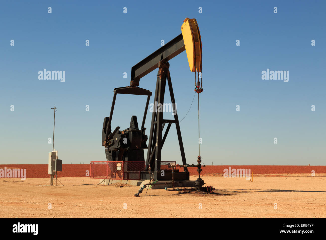 A photograph of working inland oil pump (oil donkey, nodding donkey) in ...