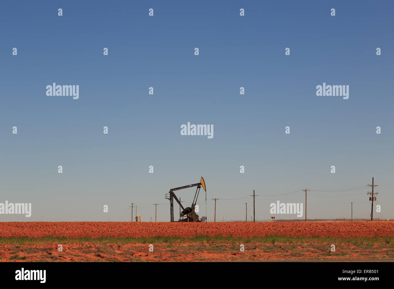 A photograph of working inland oil pump (oil donkey, nodding donkey) in ...