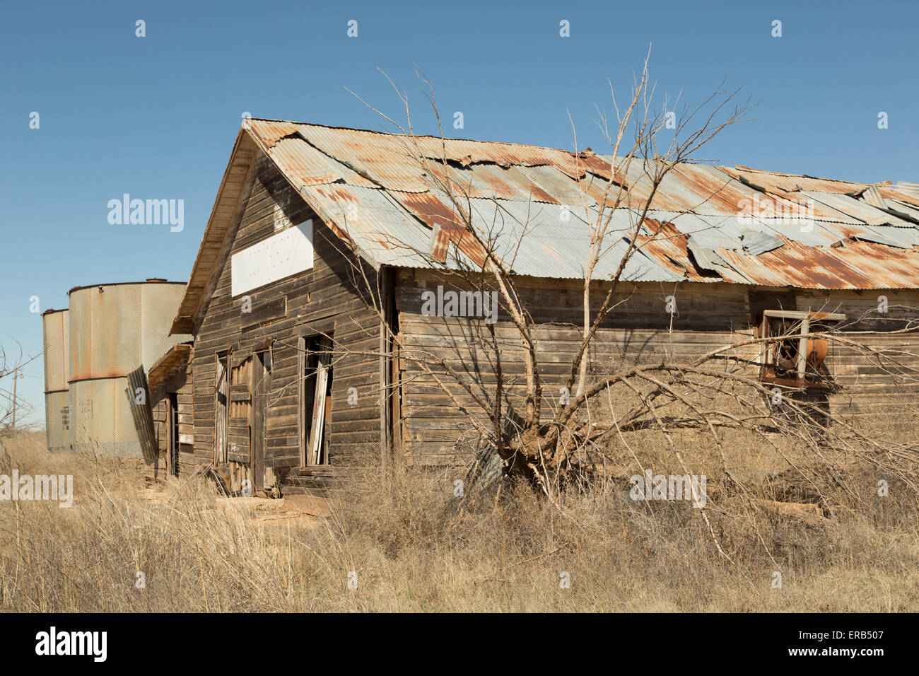 A photograph of an abandoned and partially destroyed barn in West Texas ...