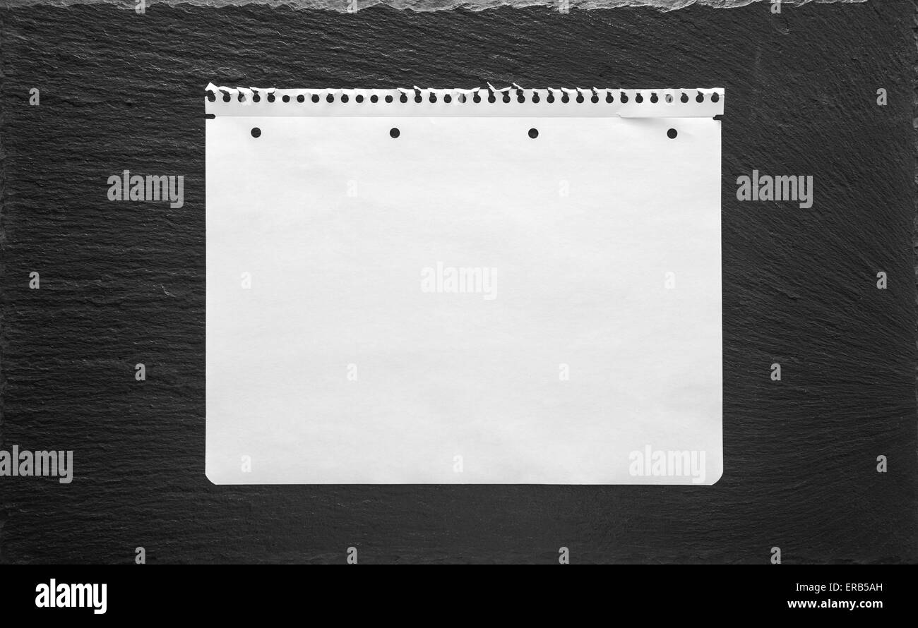 White empty paper sheet on black stone background. School book page ...