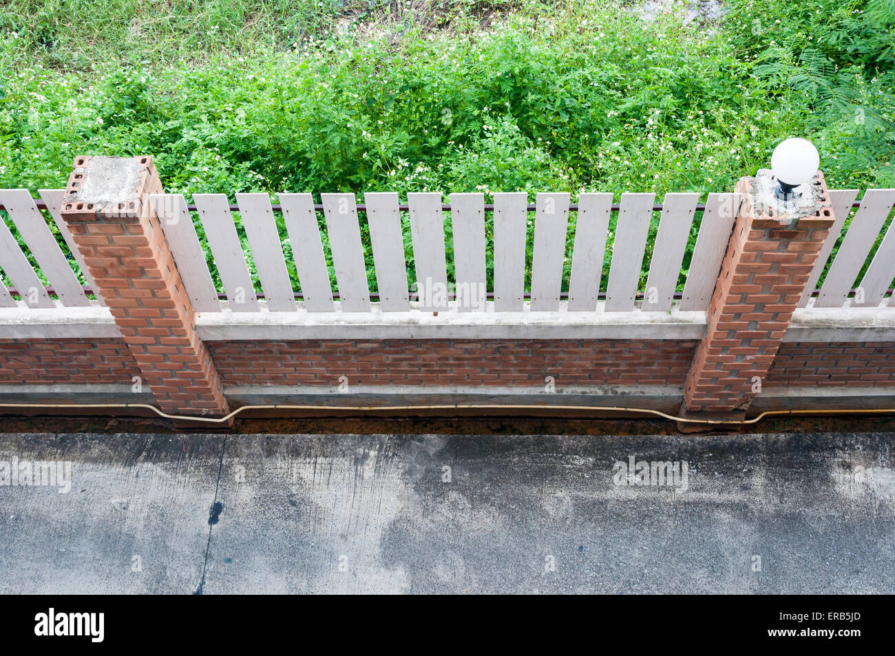 Brick house picket fence hi-res stock photography and images - Alamy