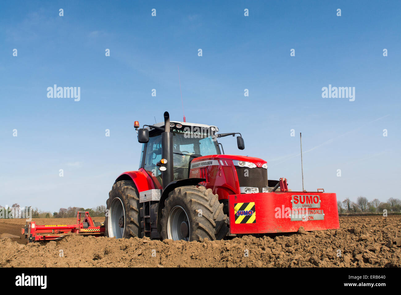 Making ridges for potato crop using a ridger pulled by a Massey ...