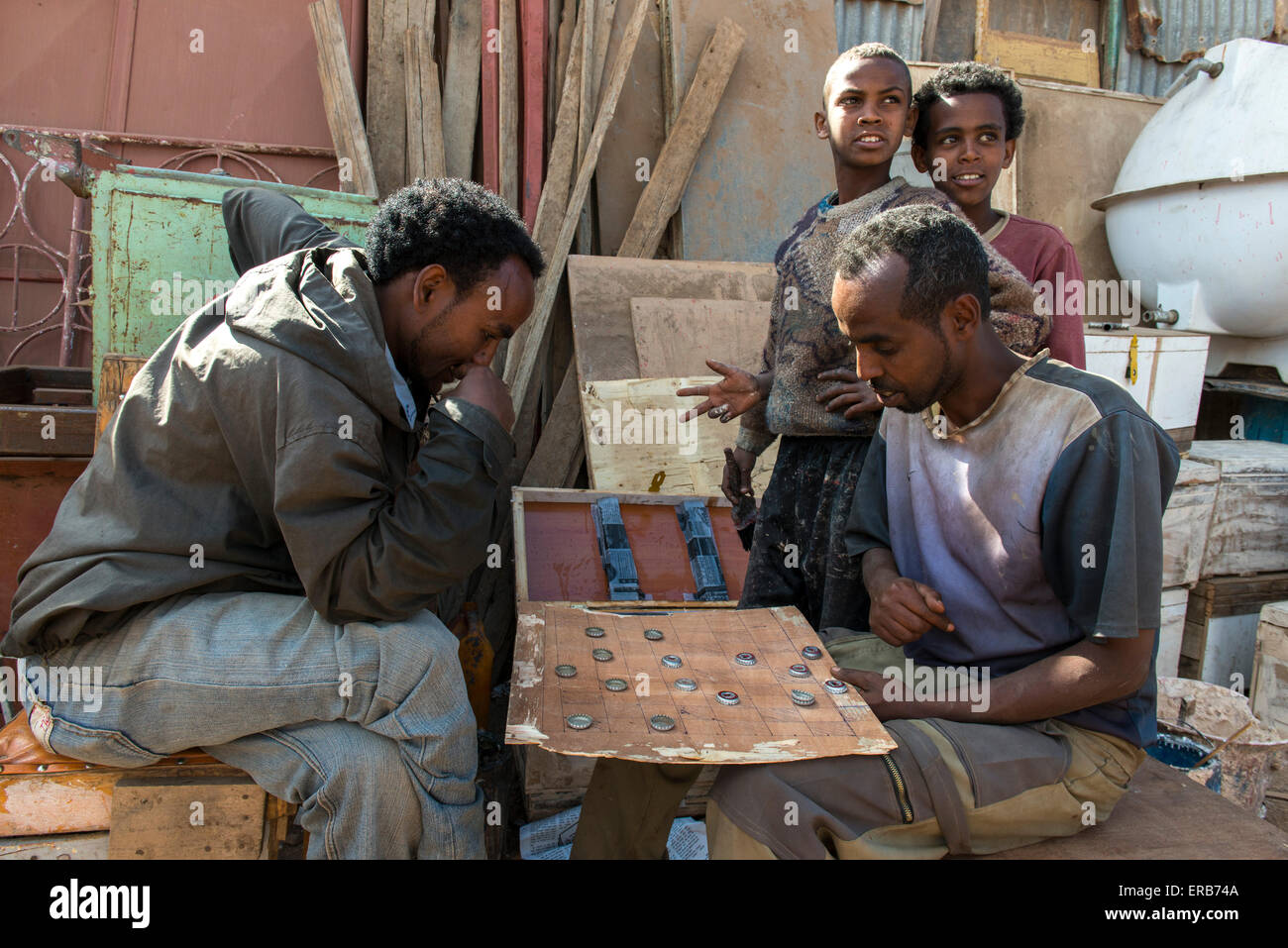 Men Playing Checkers With Beer Caps, Medebar Market, Asmara Stock Photo ...