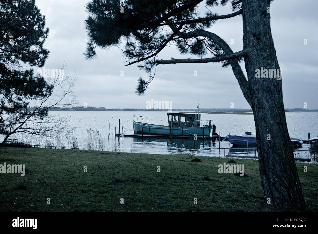 Landscape with boat and lake Stock Photo - Alamy