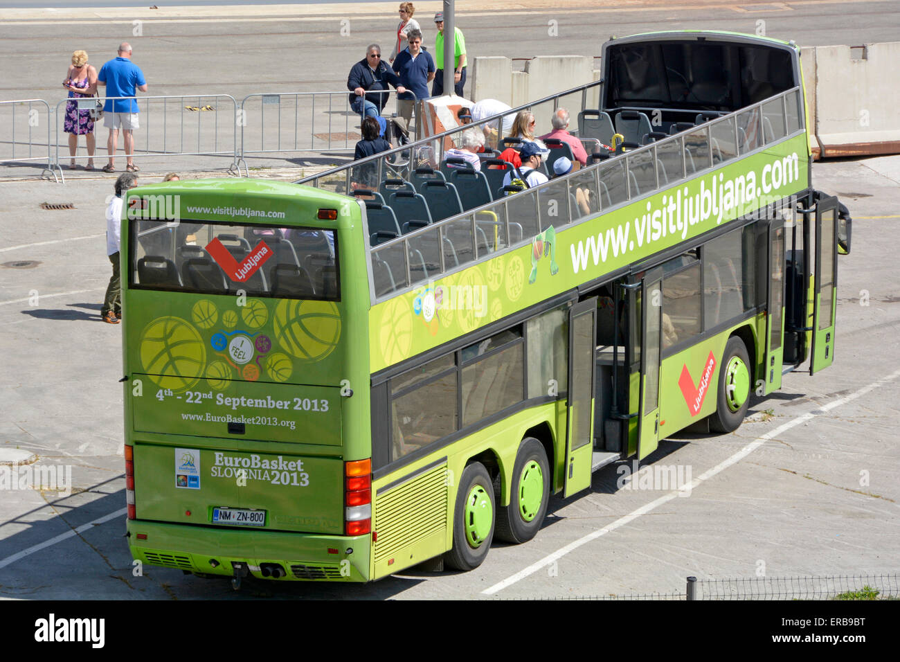 Double decker open top tour bus parked on quayside at the port of Koper ...
