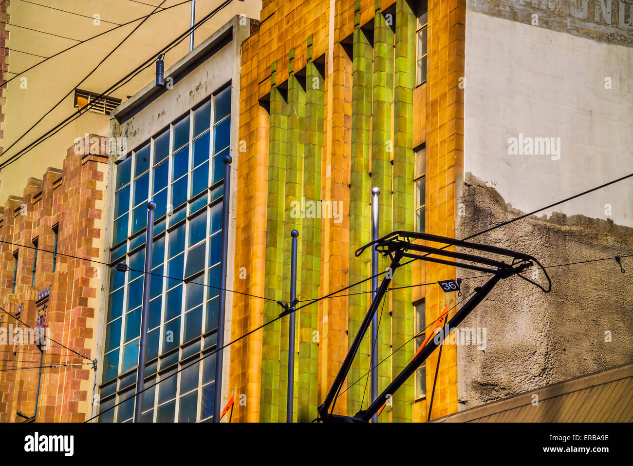 Old faded Melbourne buildings facade of green tiled architectural ...