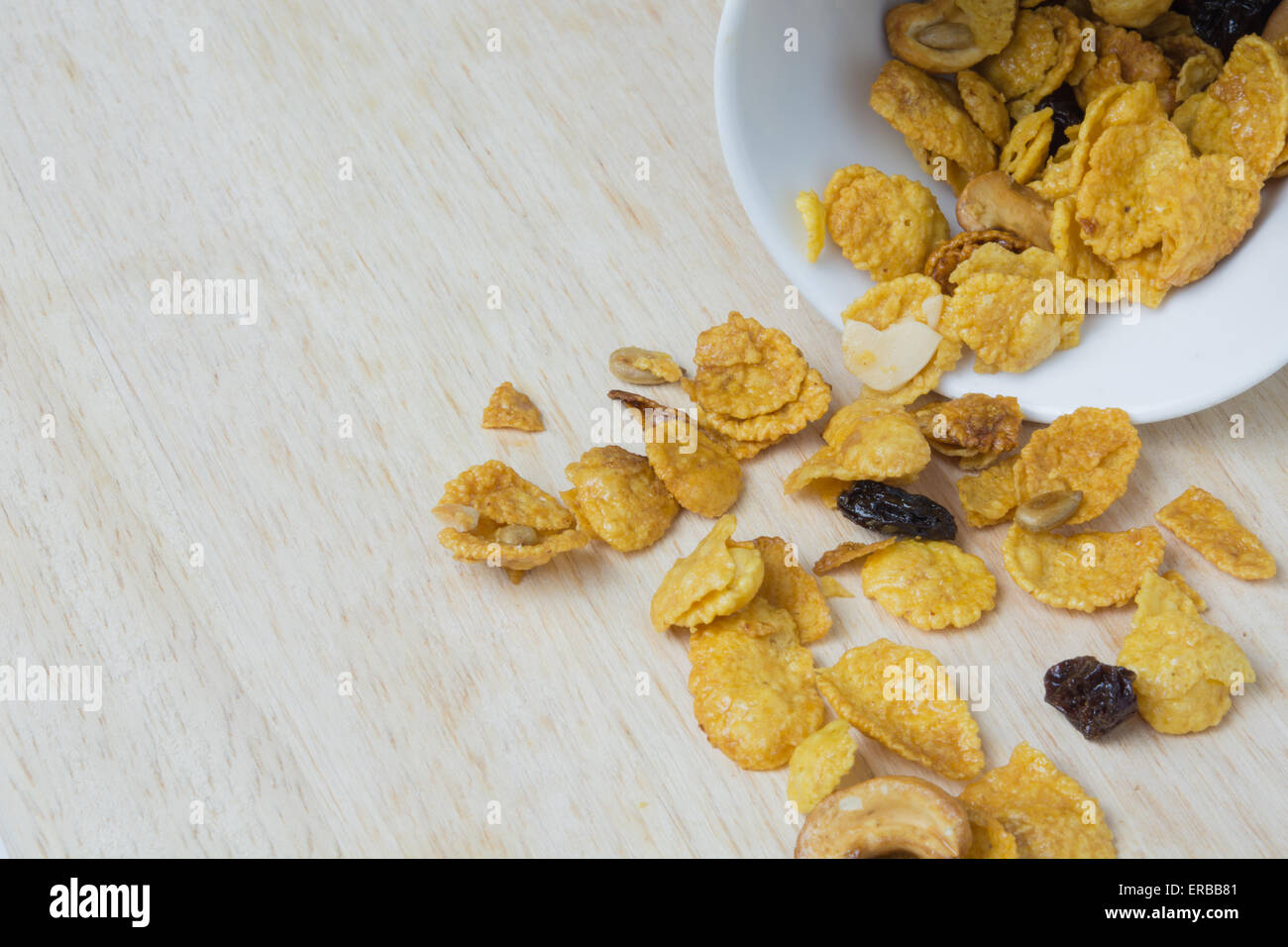 Mix cereal, corn flakes fall on the table Stock Photo - Alamy