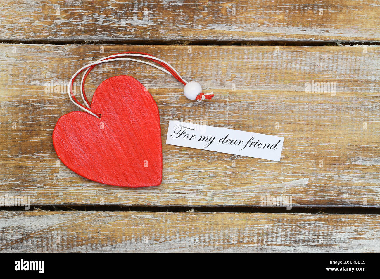 For my dear friend card with red wooden heart on rustic wood Stock ...