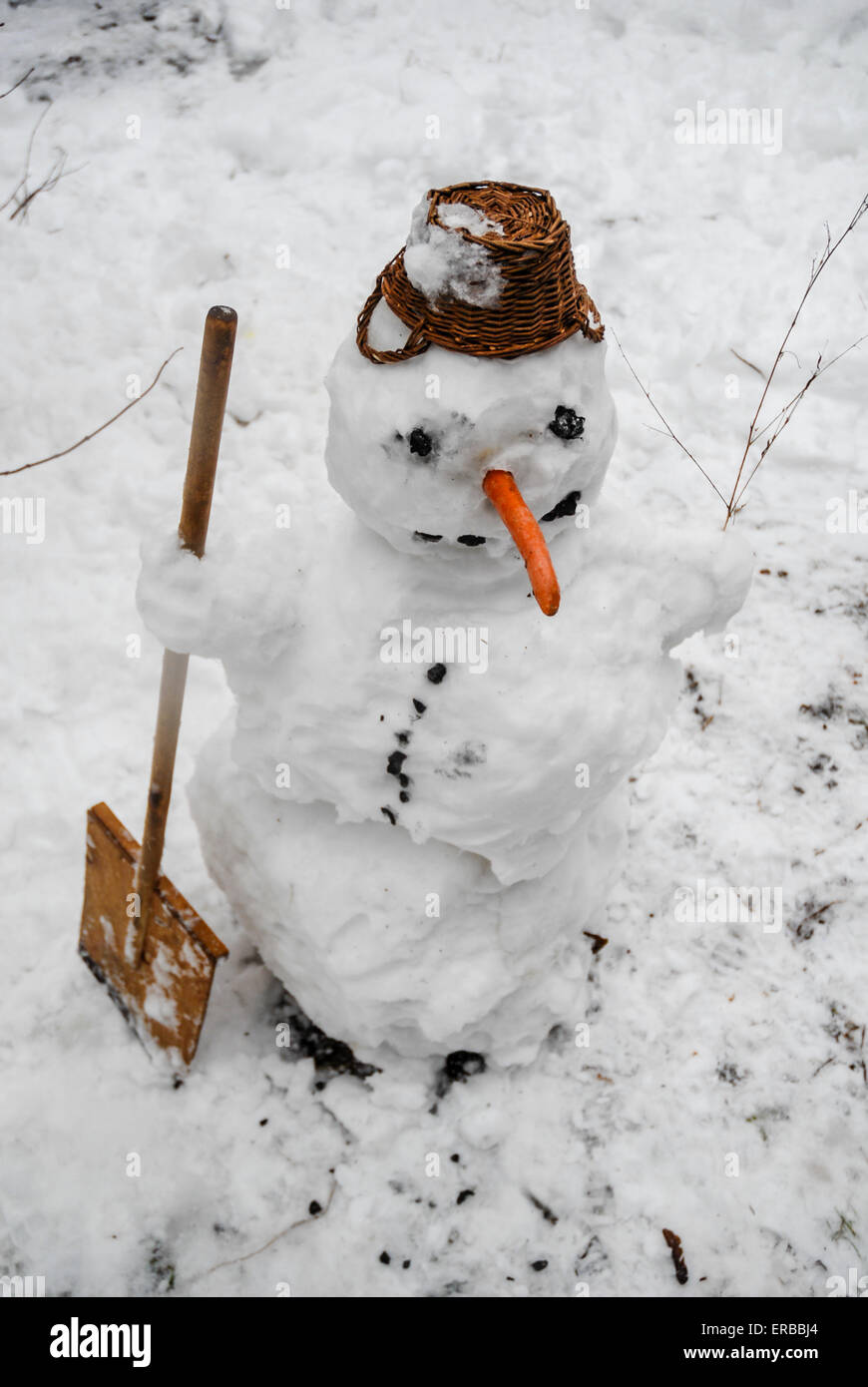 Snowman with shovel hi-res stock photography and images - Alamy