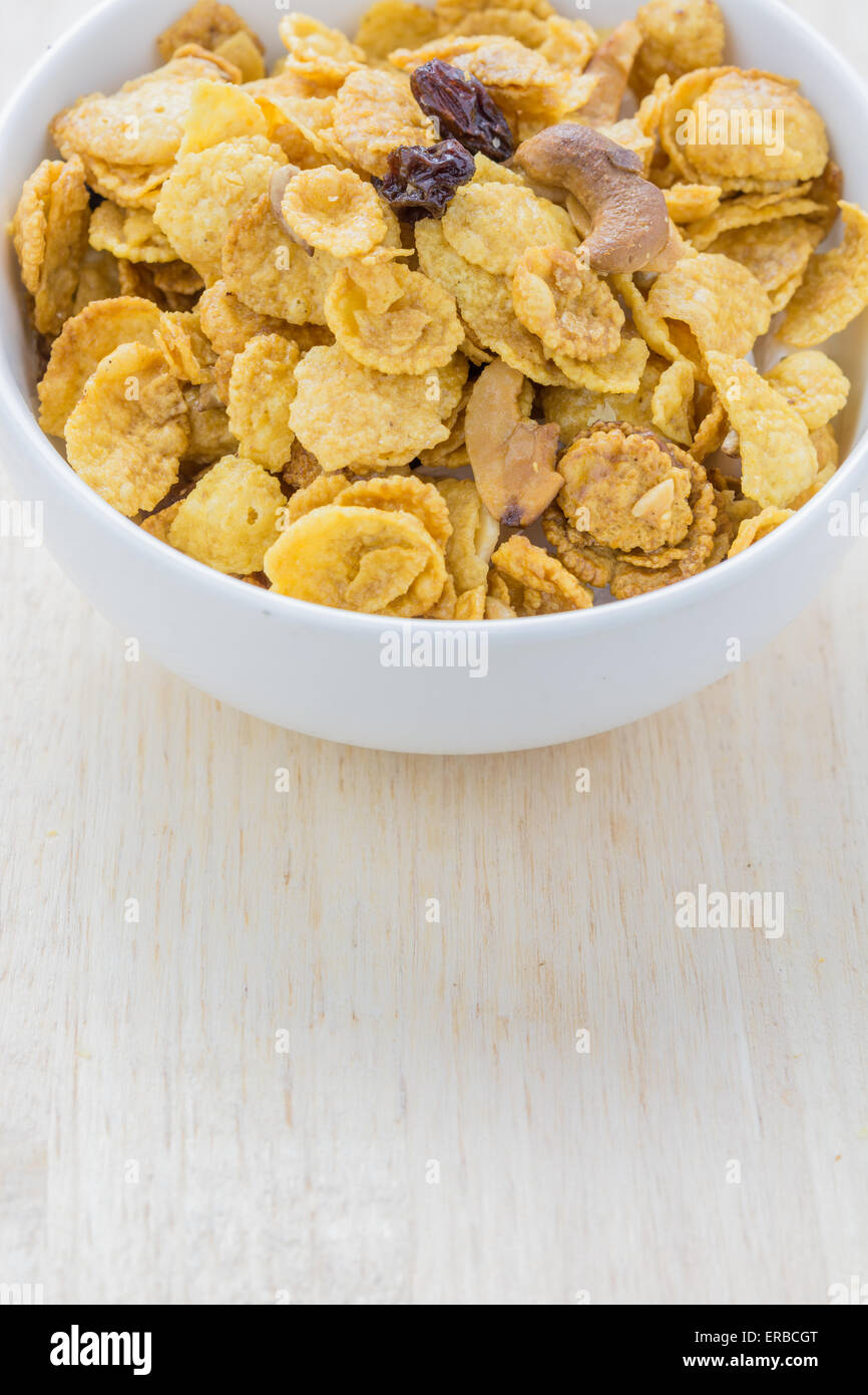 Mix corn flake cereal in a white bowl on the table Stock Photo - Alamy