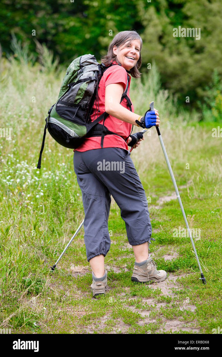 older woman is hiking in nature Stock Photo - Alamy
