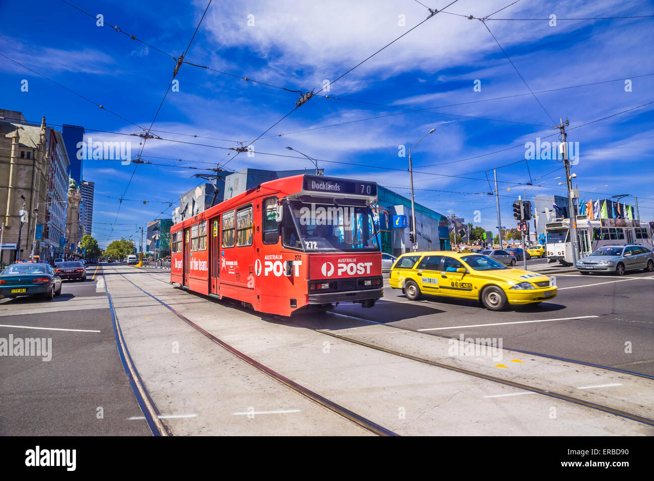 Australia Post red tram and yellow cab, Flinders Street Melbourne ...