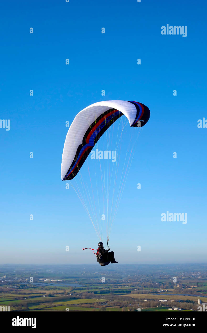 A Paraglider flying above the Westbury White Horse in Wiltshire, United ...