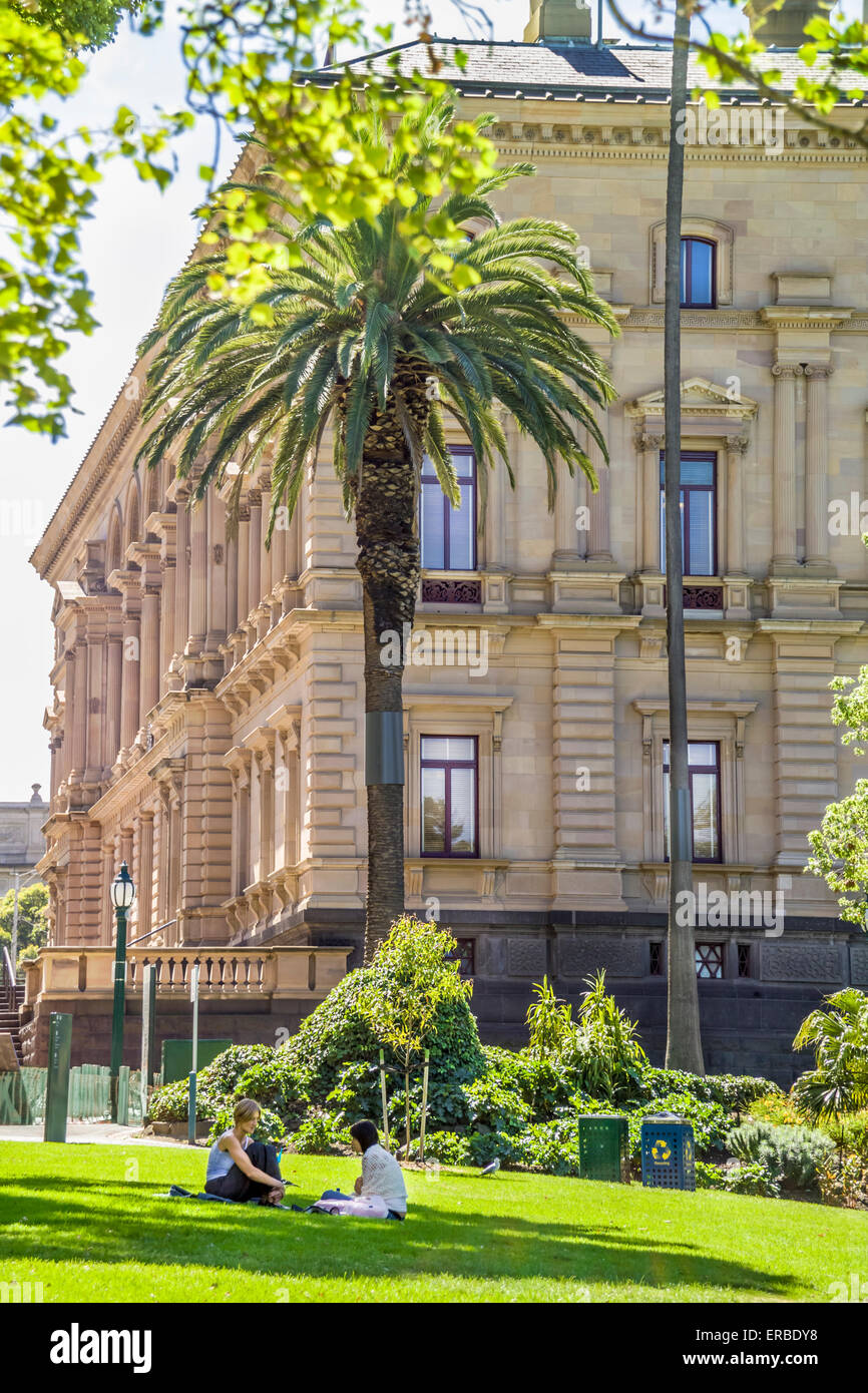 Two women sitting under tree hi-res stock photography and images - Alamy