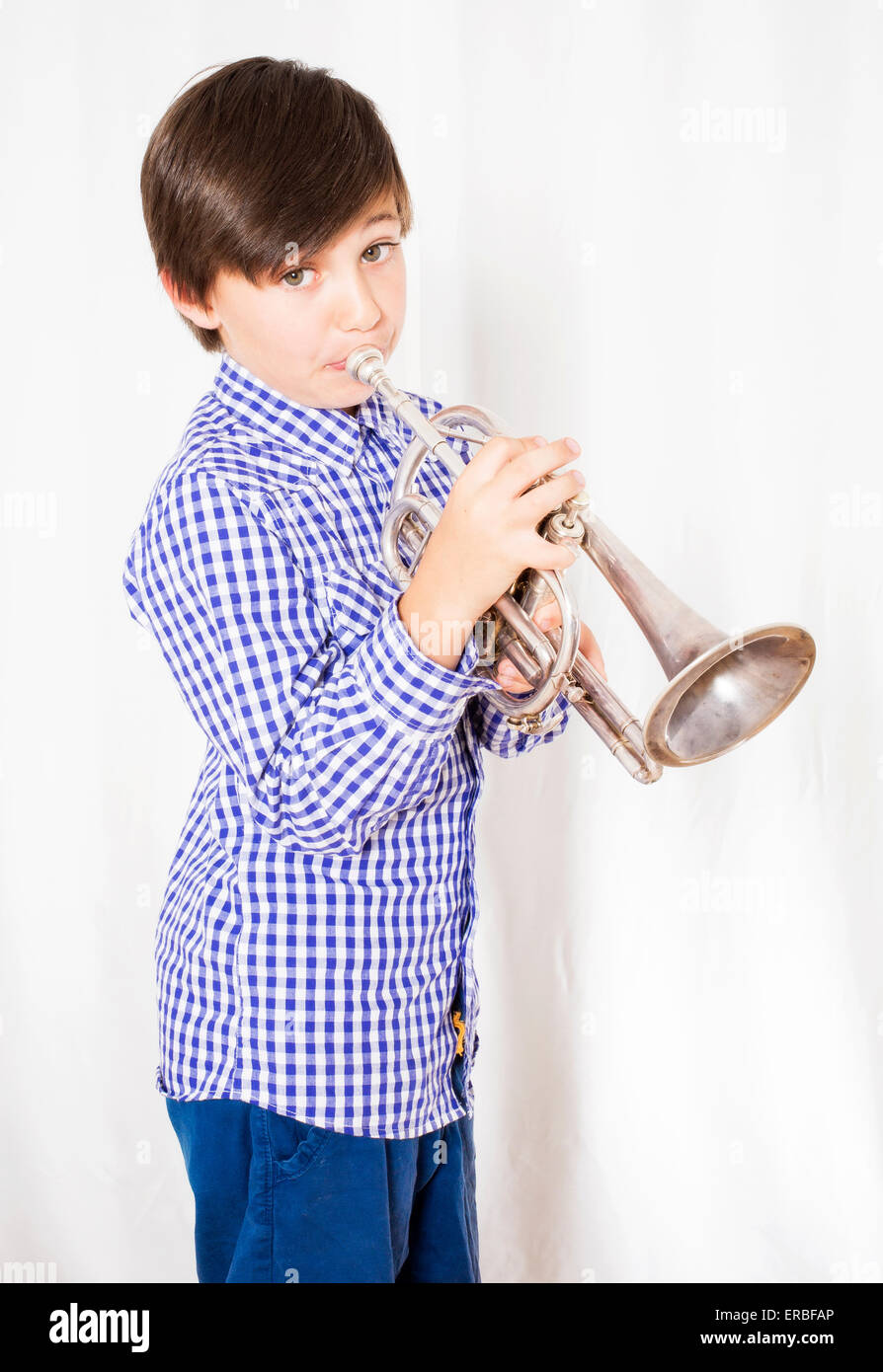 portrait of a boy playing the trumpet Stock Photo - Alamy