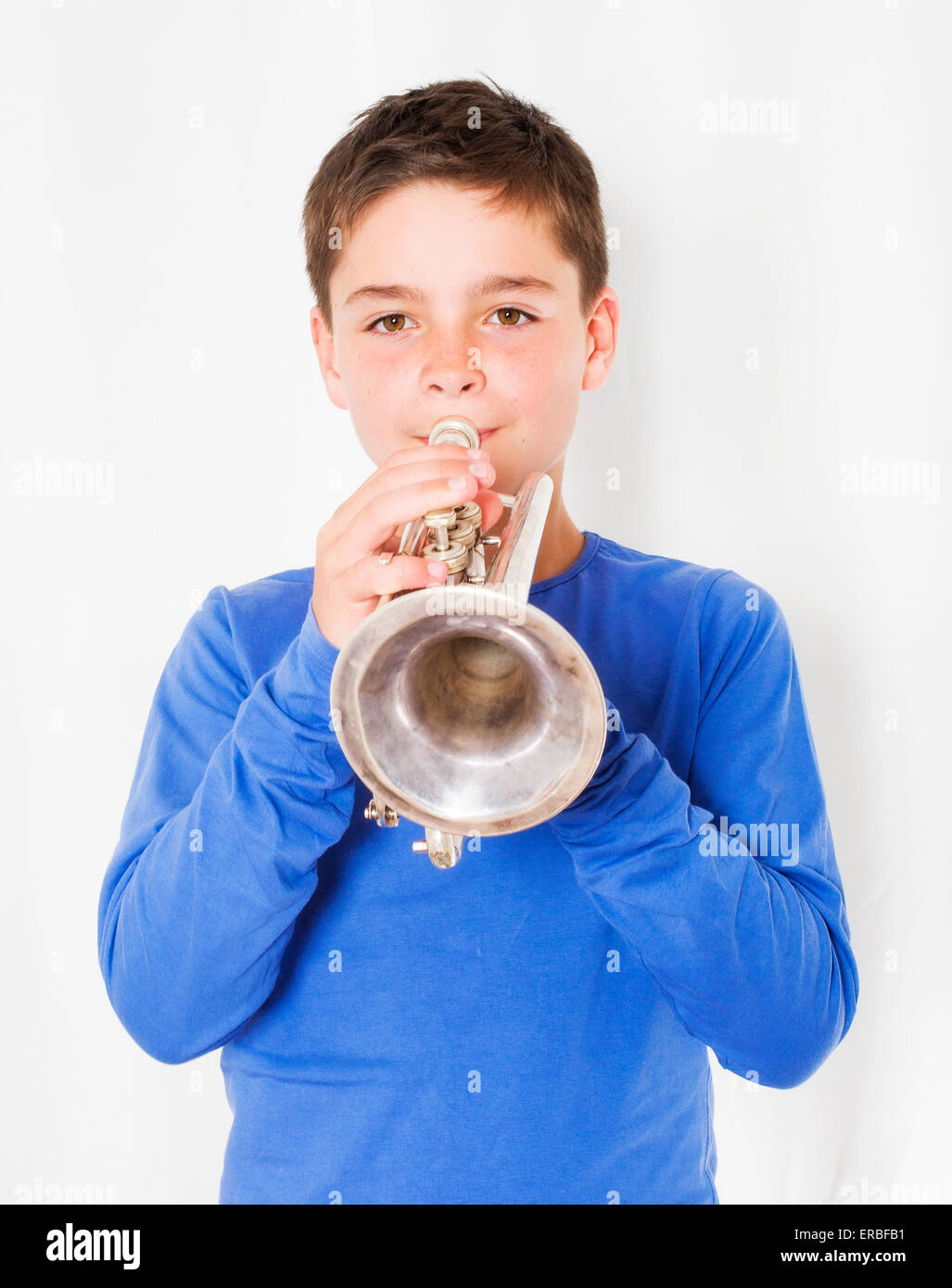 Kid playing trumpet hi-res stock photography and images - Alamy