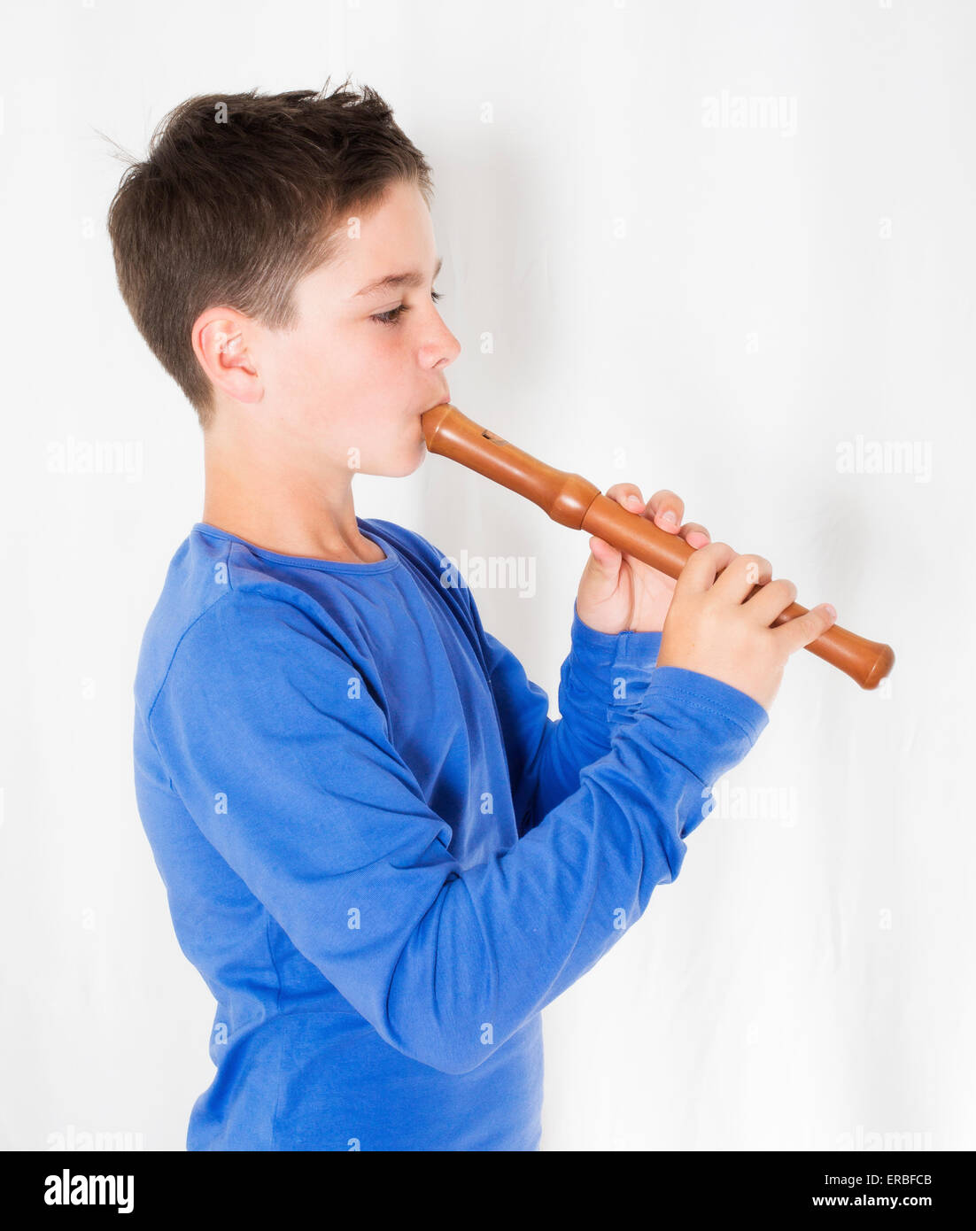young boy playing on a flute Stock Photo - Alamy