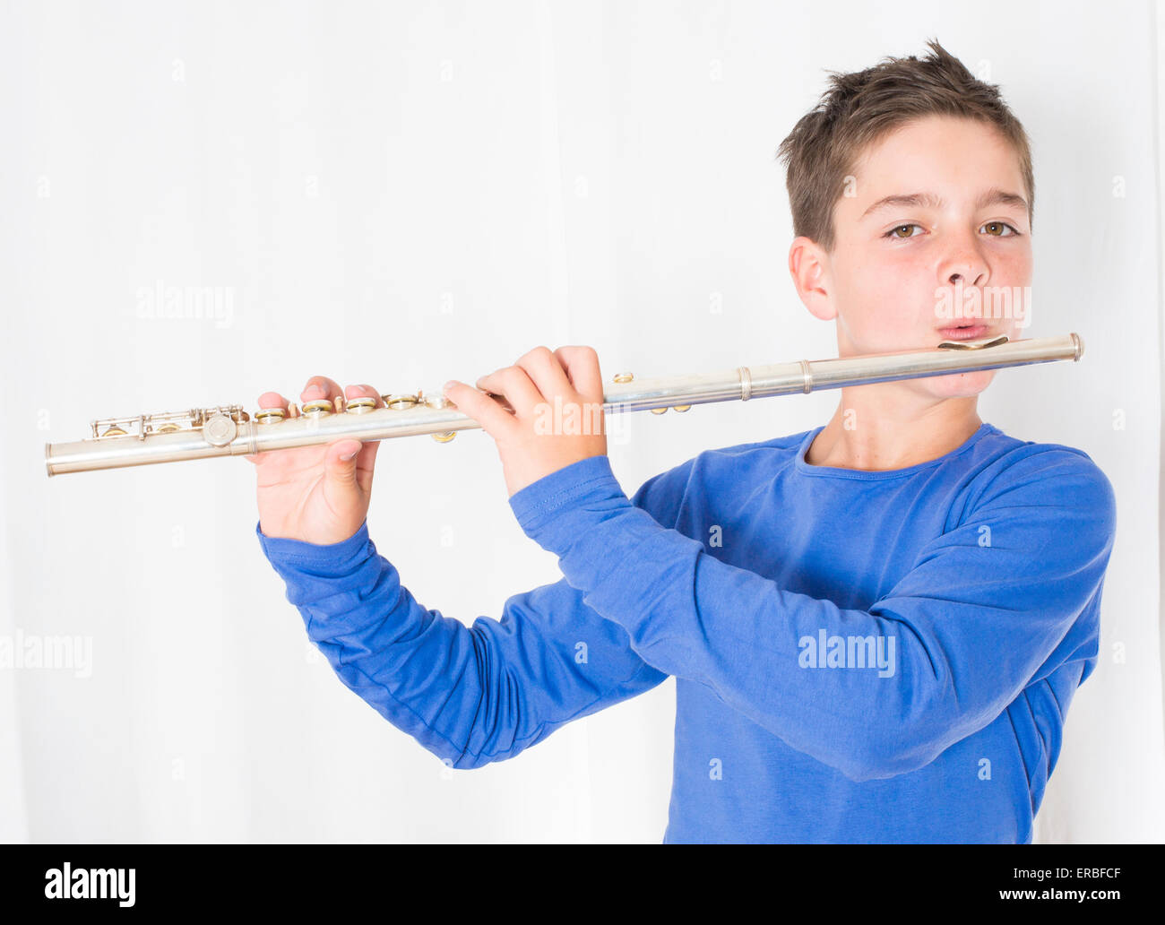 portrait of a boy playing the flute Stock Photo - Alamy