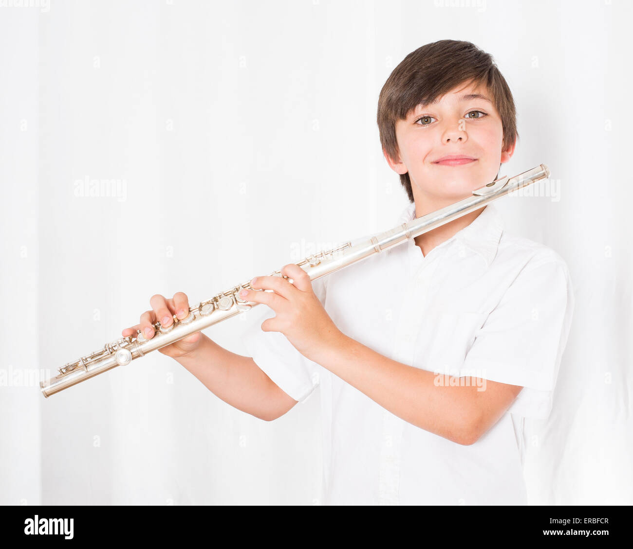portrait of a boy holding a flute in his hands Stock Photo - Alamy