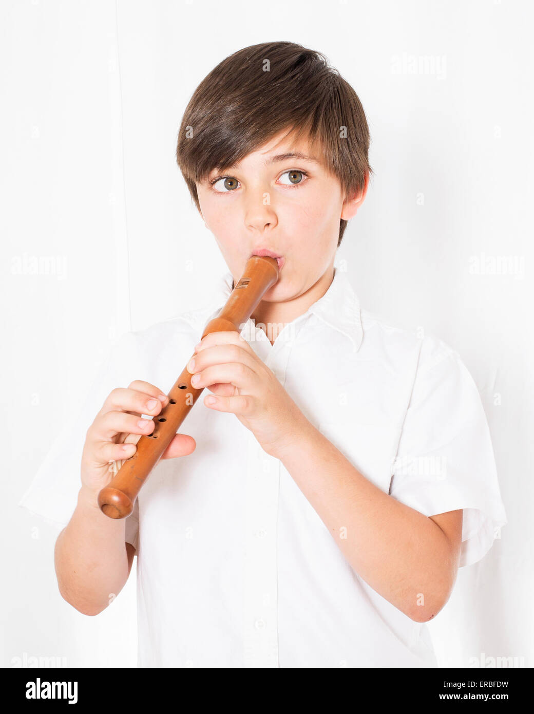 portrait of a boy playing the flute Stock Photo - Alamy