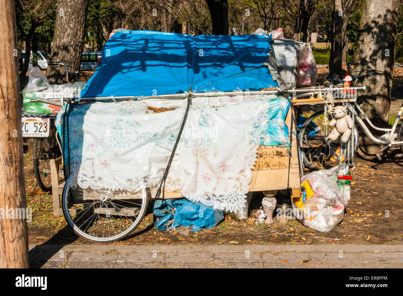 Japan, Nagoya. A typical blue tarpaulin self built homeless shelter in ...