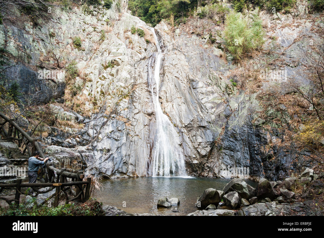 The Nunobiki waterfall, men-daki, plunging down rock face into large ...