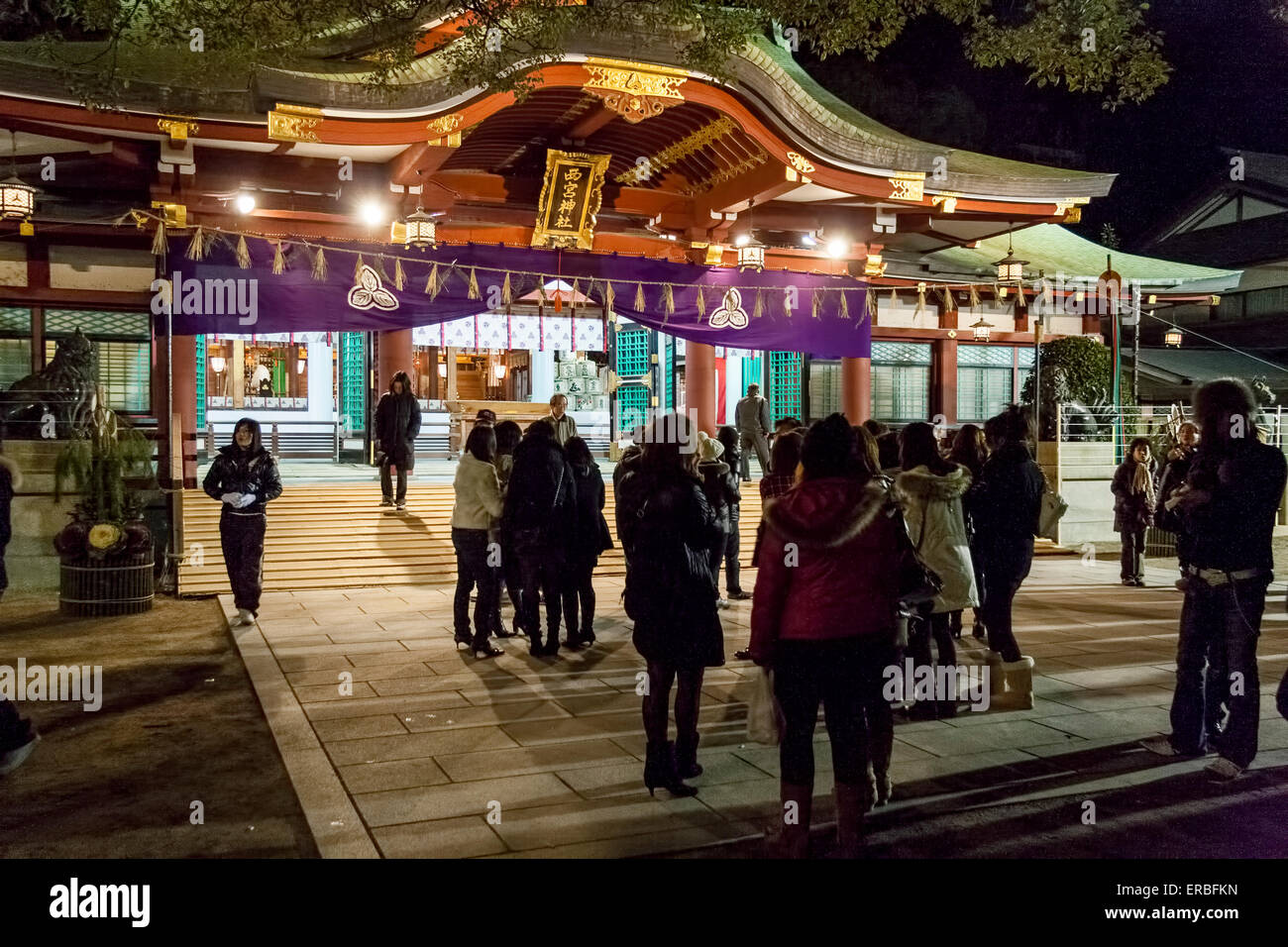 People gathering in the evening just before midnight outside the main ...