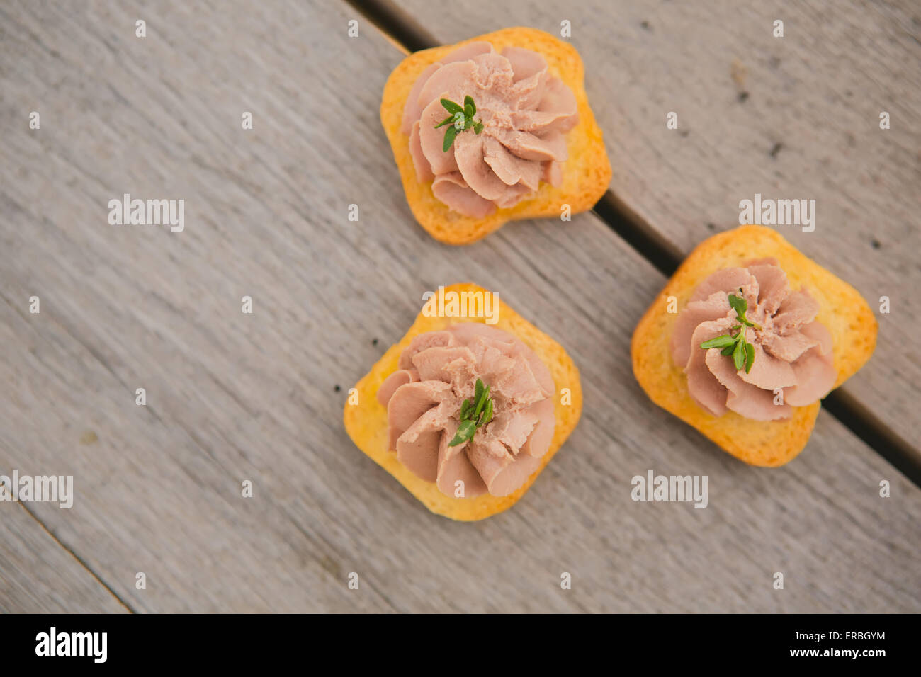 Delicious Pate Canapes on wooden background. Selective focus, shallow ...