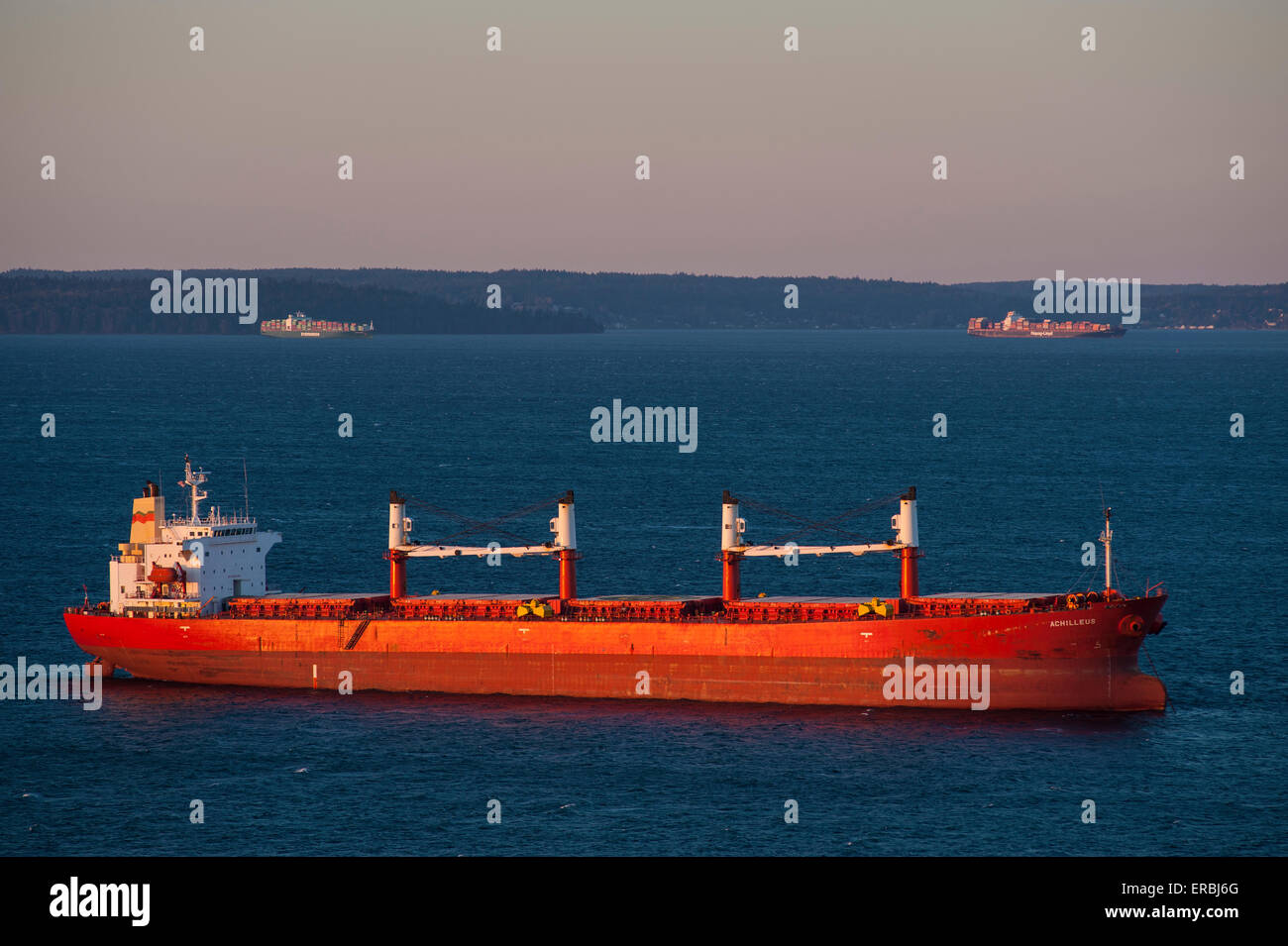 Cargo ships waiting in Puget Sound to off load containers sunrise Stock ...