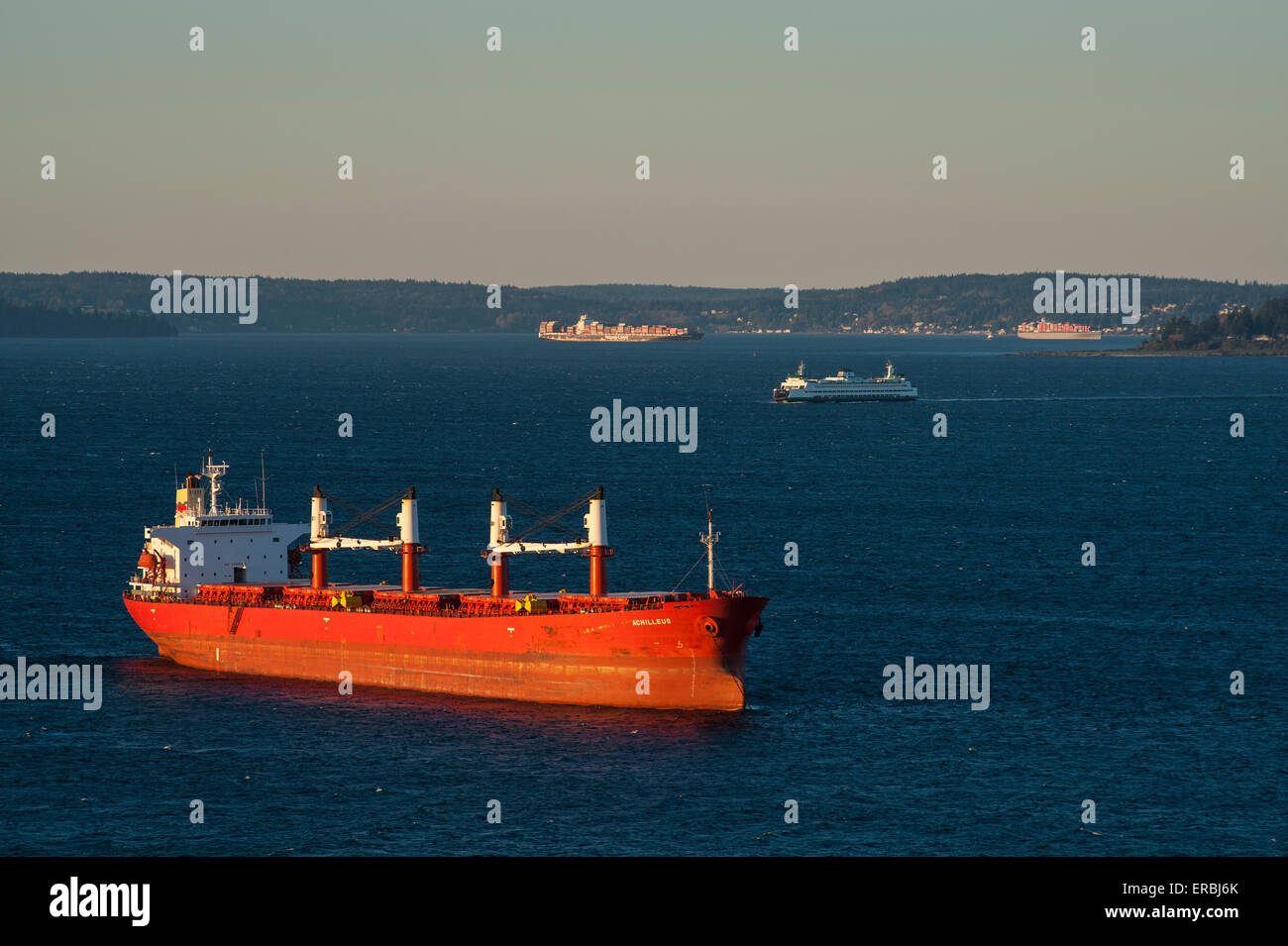 Cargo ships waiting in Puget Sound to off load containers sunrise with ...