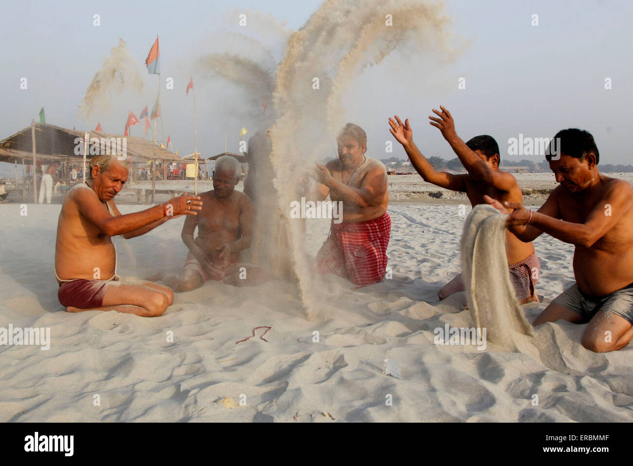 Allahabad, India. 31st May, 2015. People doing sand bath to pray for ...