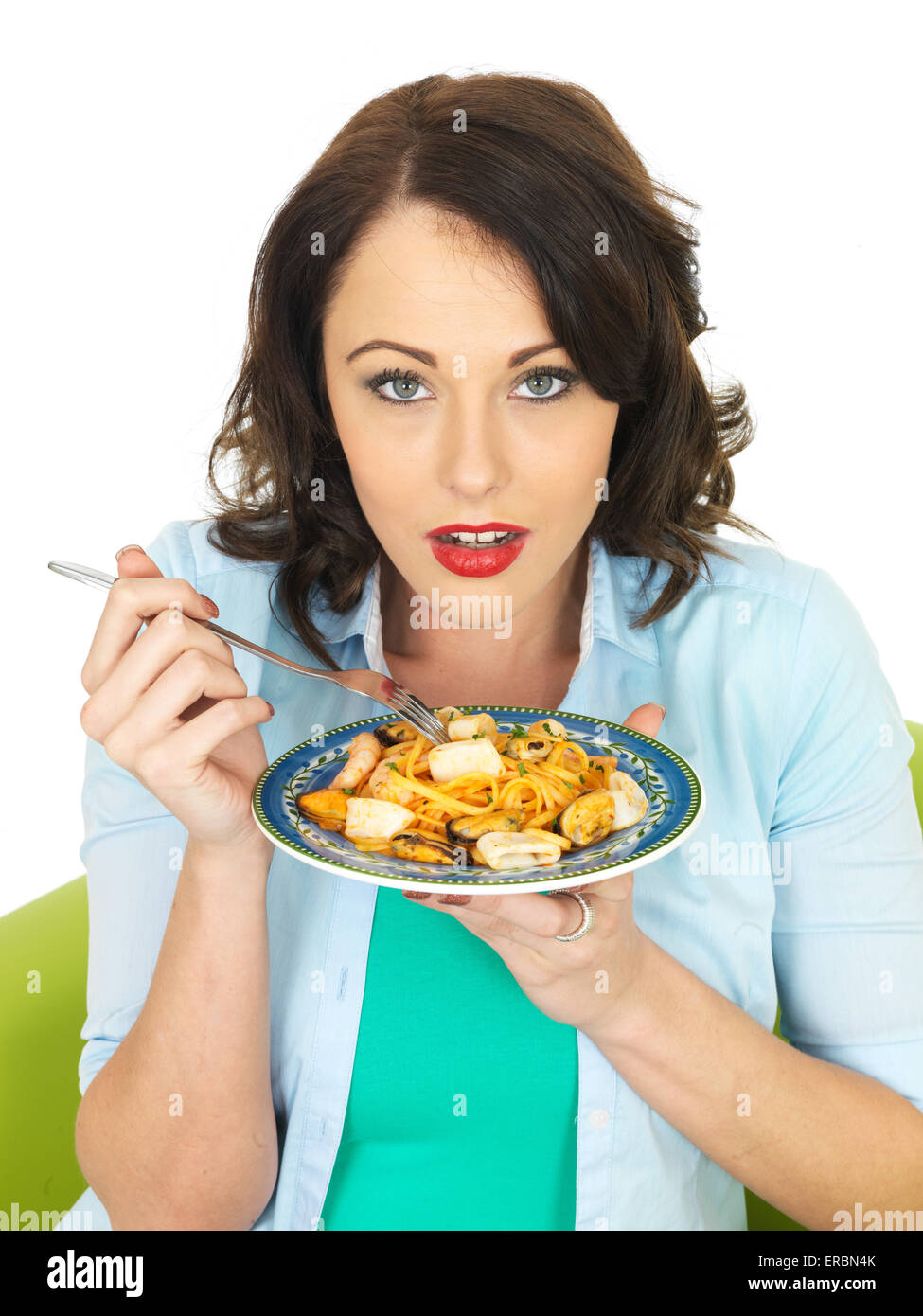 Confident Happy Young Woman Eating Italian Style Seafood Linguine Pasta