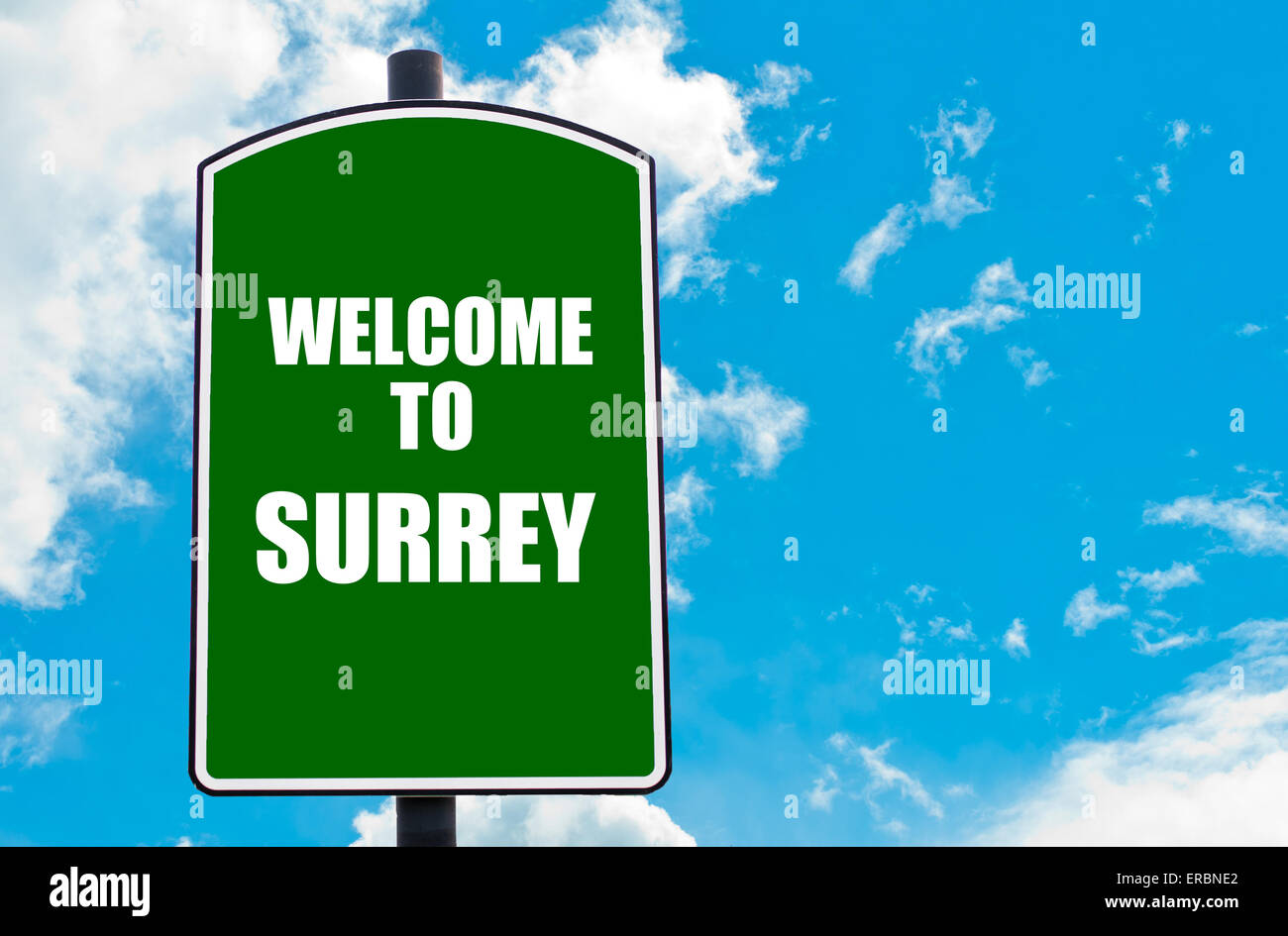 Green road sign with greeting message WELCOME TO SURREY, ENGLAND ...