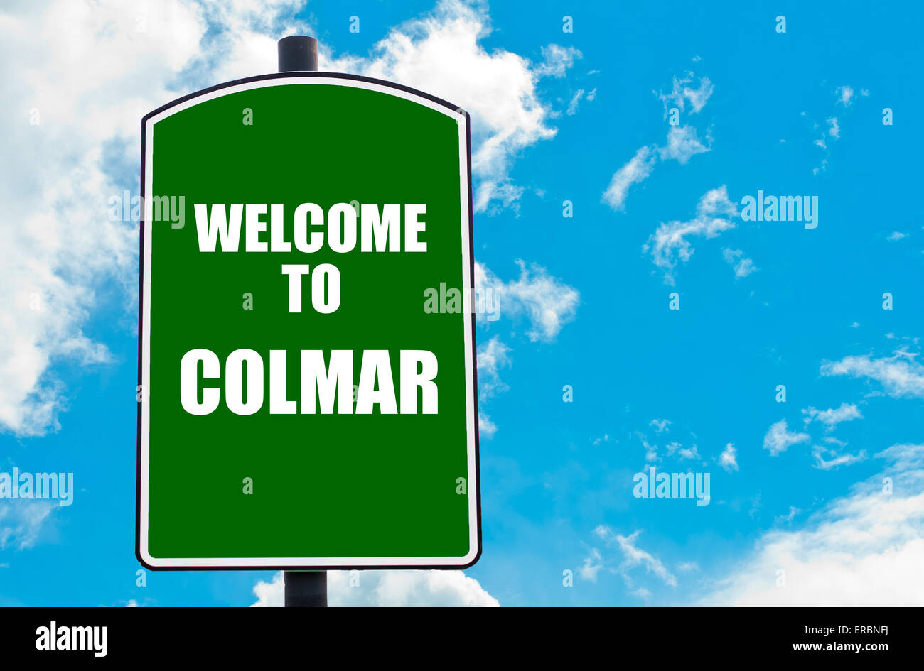 Green road sign with greeting message WELCOME TO COLMAR isolated over ...