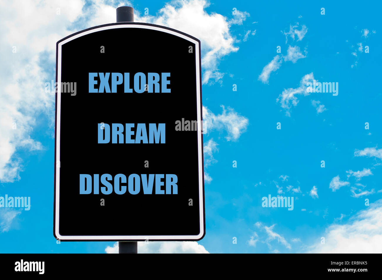 EXPLORE DREAM DISCOVER motivational quote written on road sign isolated ...