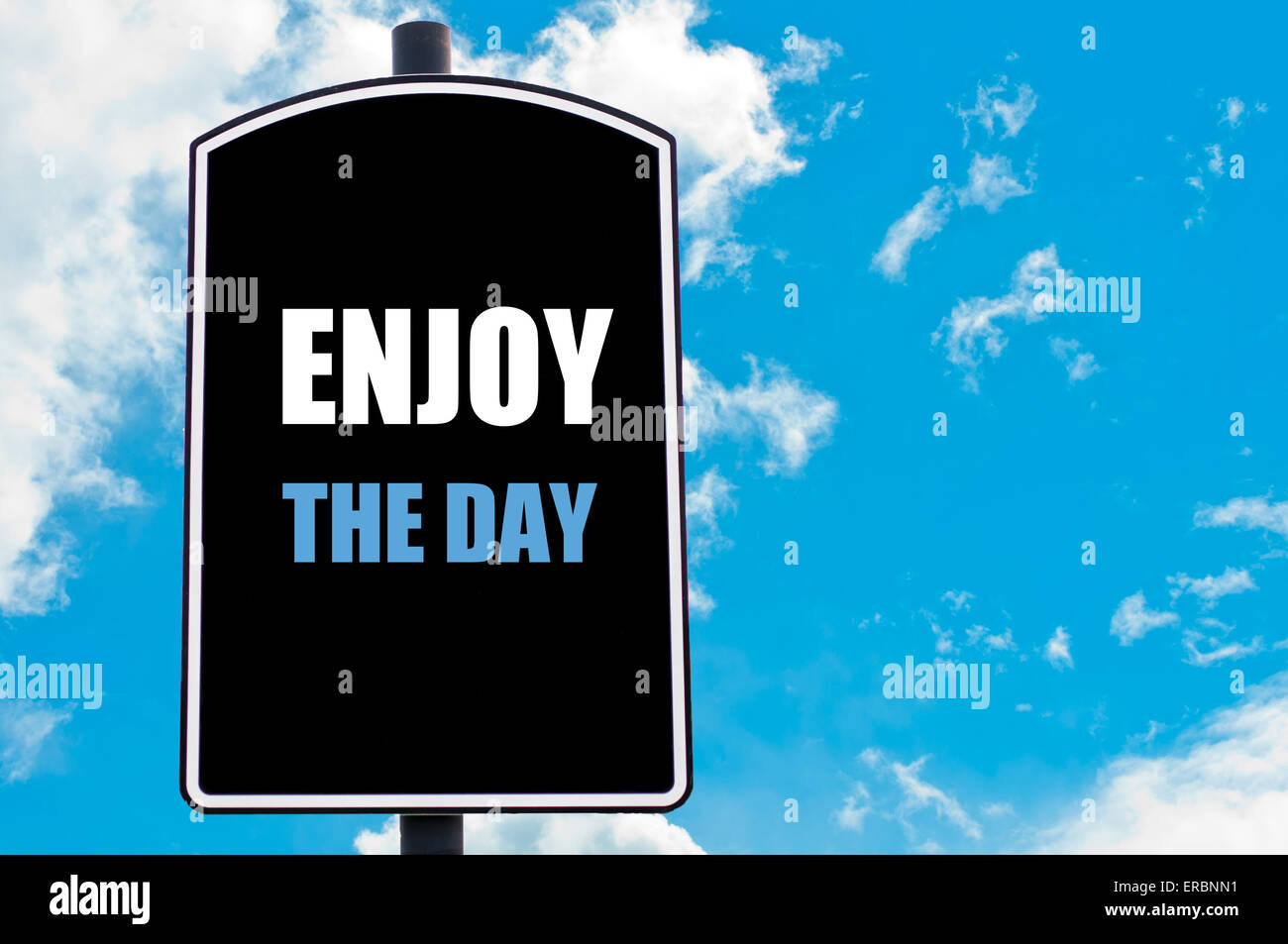 ENJOY THE DAY motivational quote written on road sign isolated over ...
