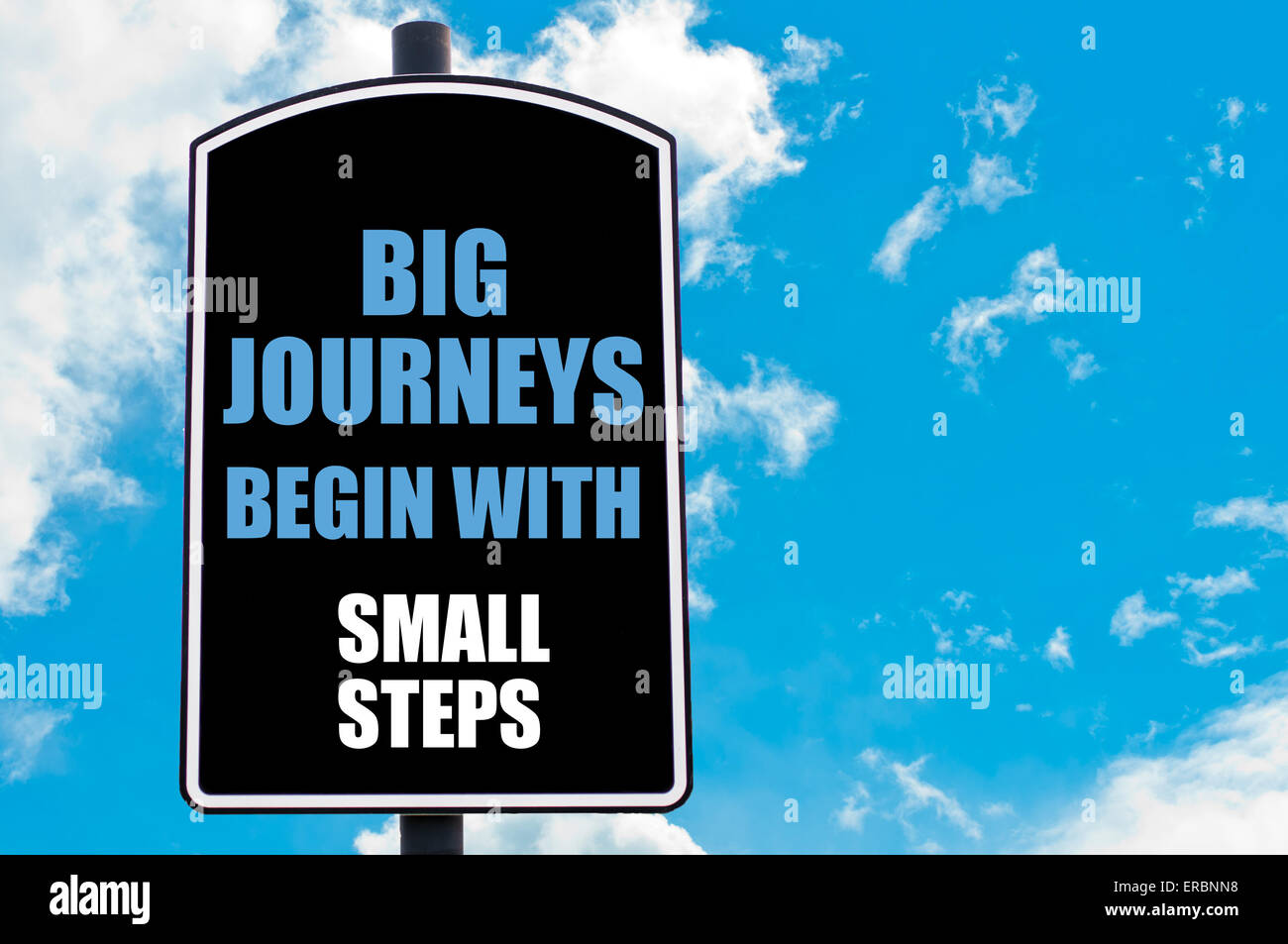 BIG JOURNEYS BEGIN WITH SMALL STEPS motivational quote written on road ...