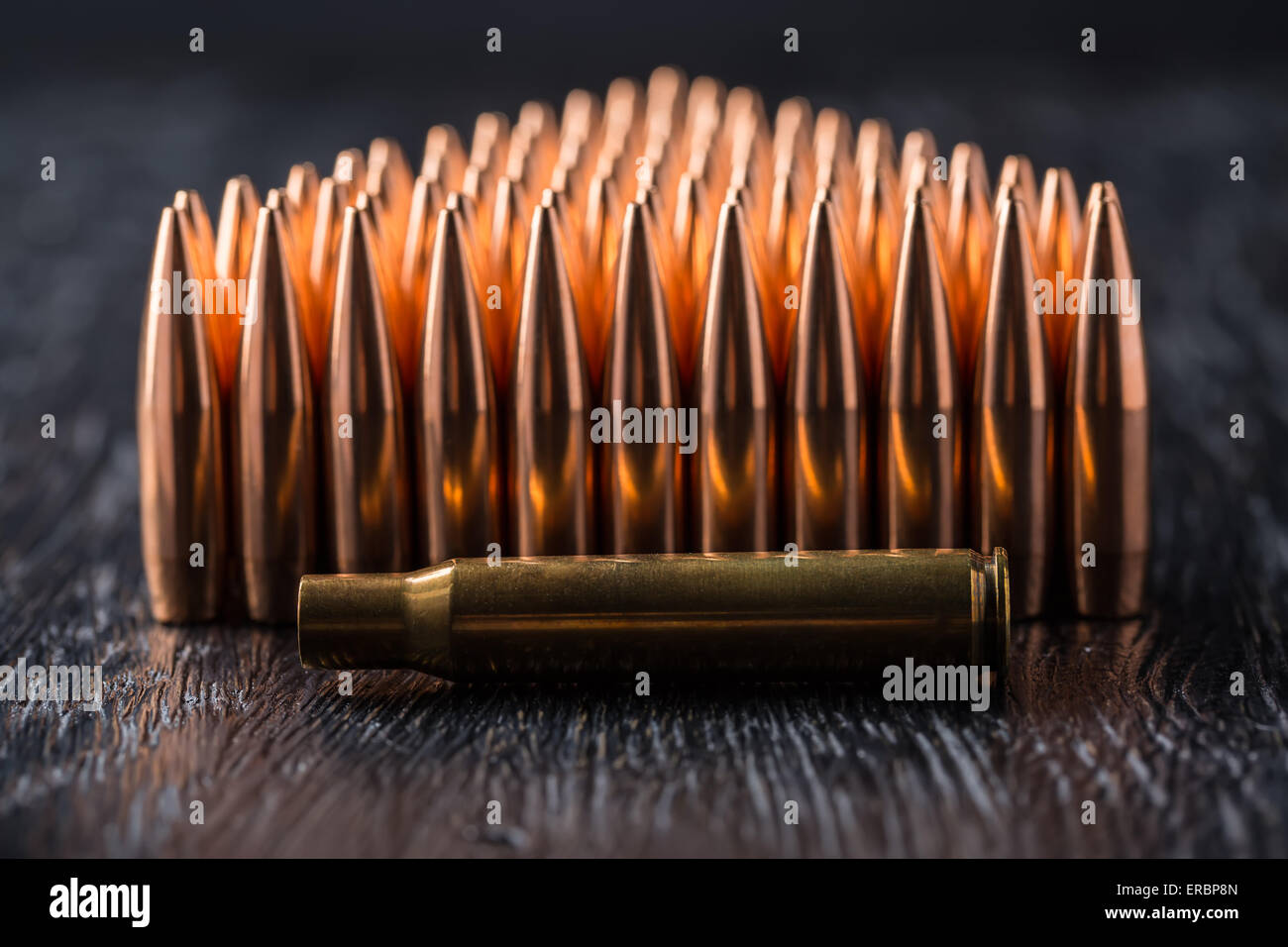 Macro shot of copper bullets that are in many rows to form a tri Stock ...