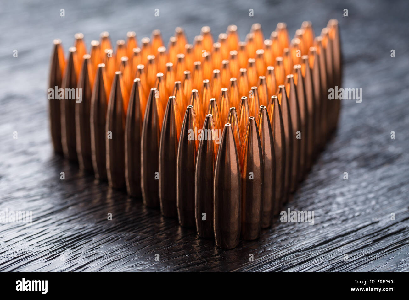 Macro shot of copper bullets that are in many rows to form a triangle ...