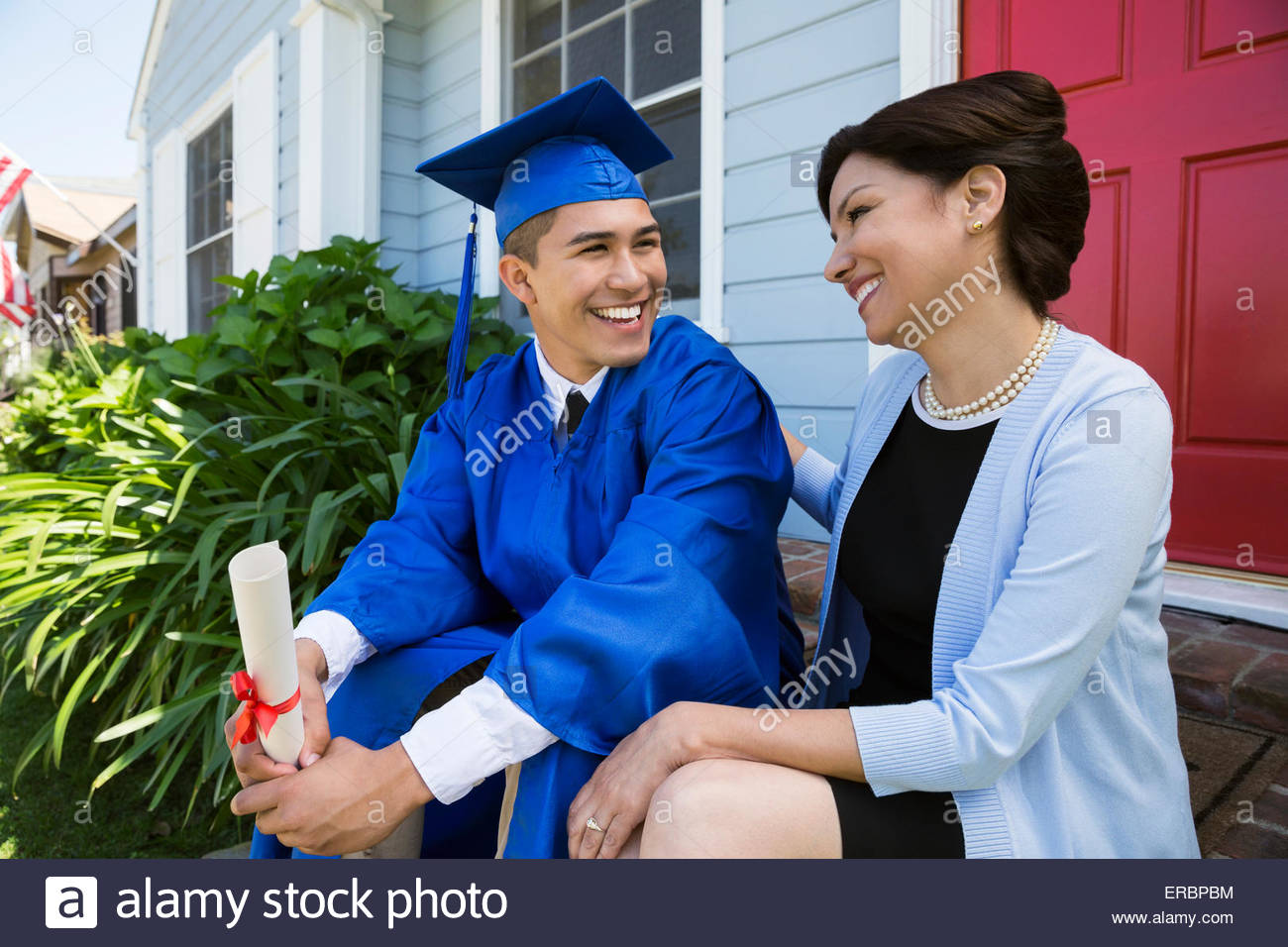 Young woman sitting on stoop hi-res stock photography and images - Alamy
