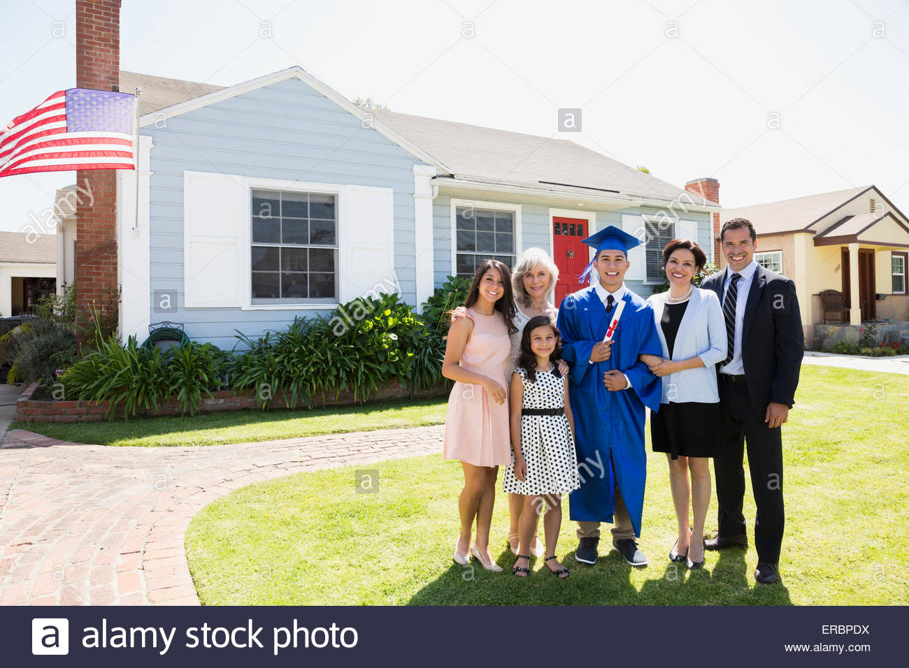 Portrait smiling graduate multi-generation family front yard Stock ...