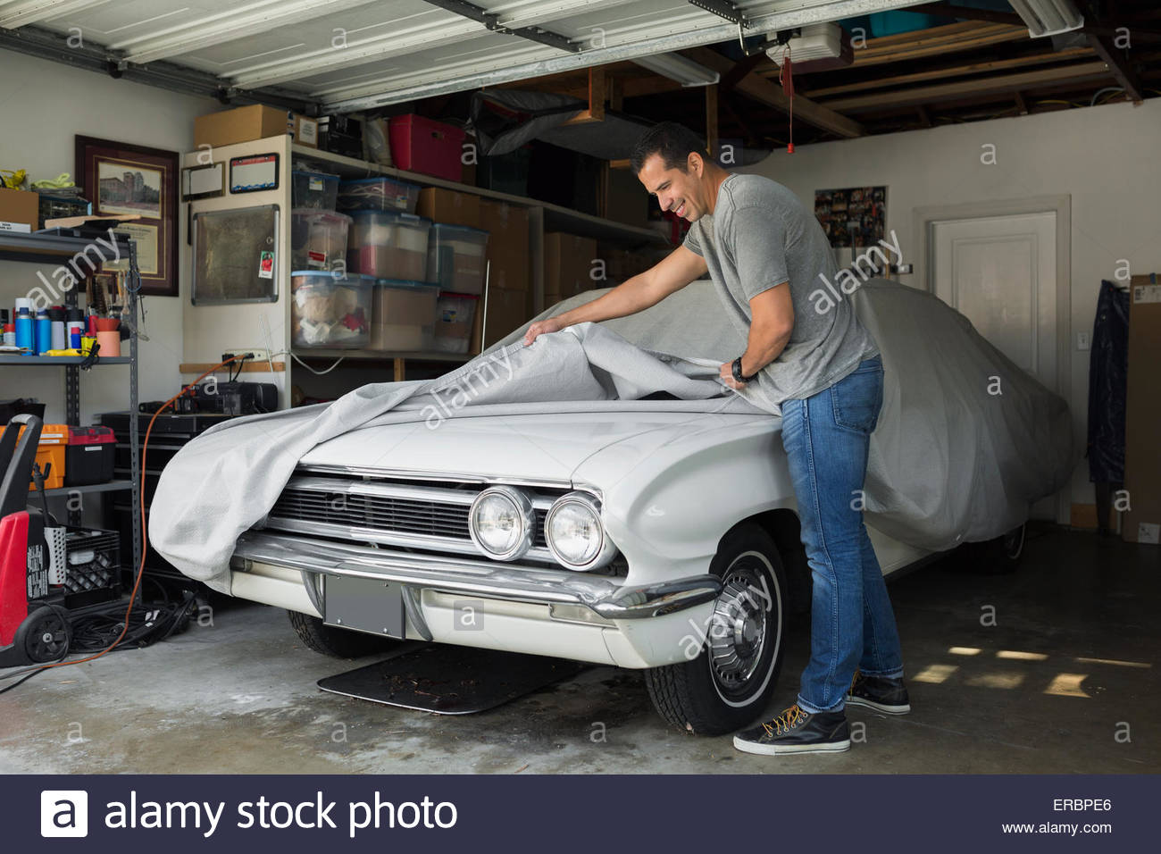Man in garage with car hi-res stock photography and images - Alamy