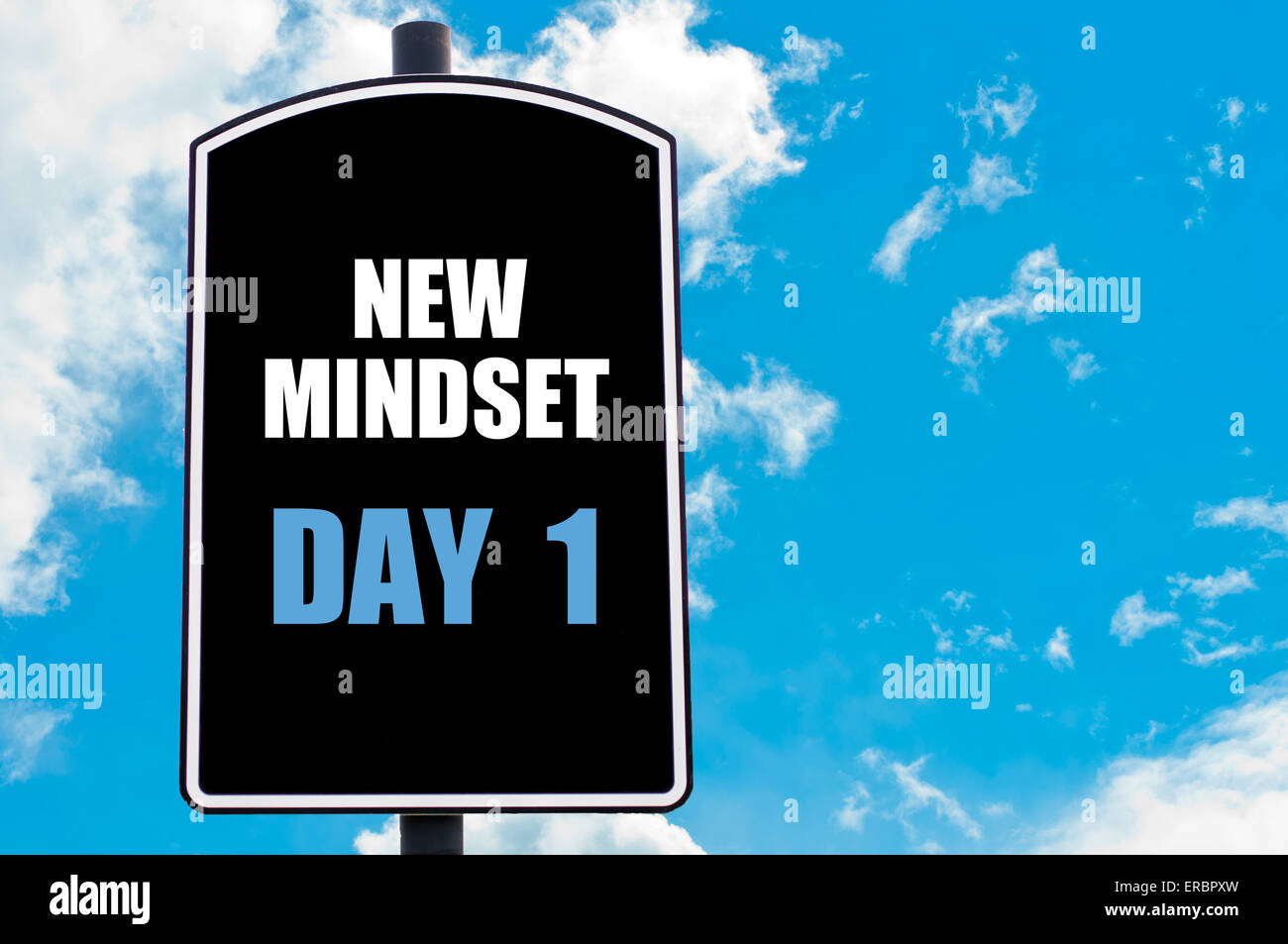 NEW MINDSET DAY ONE motivational quote written on road sign isolated ...