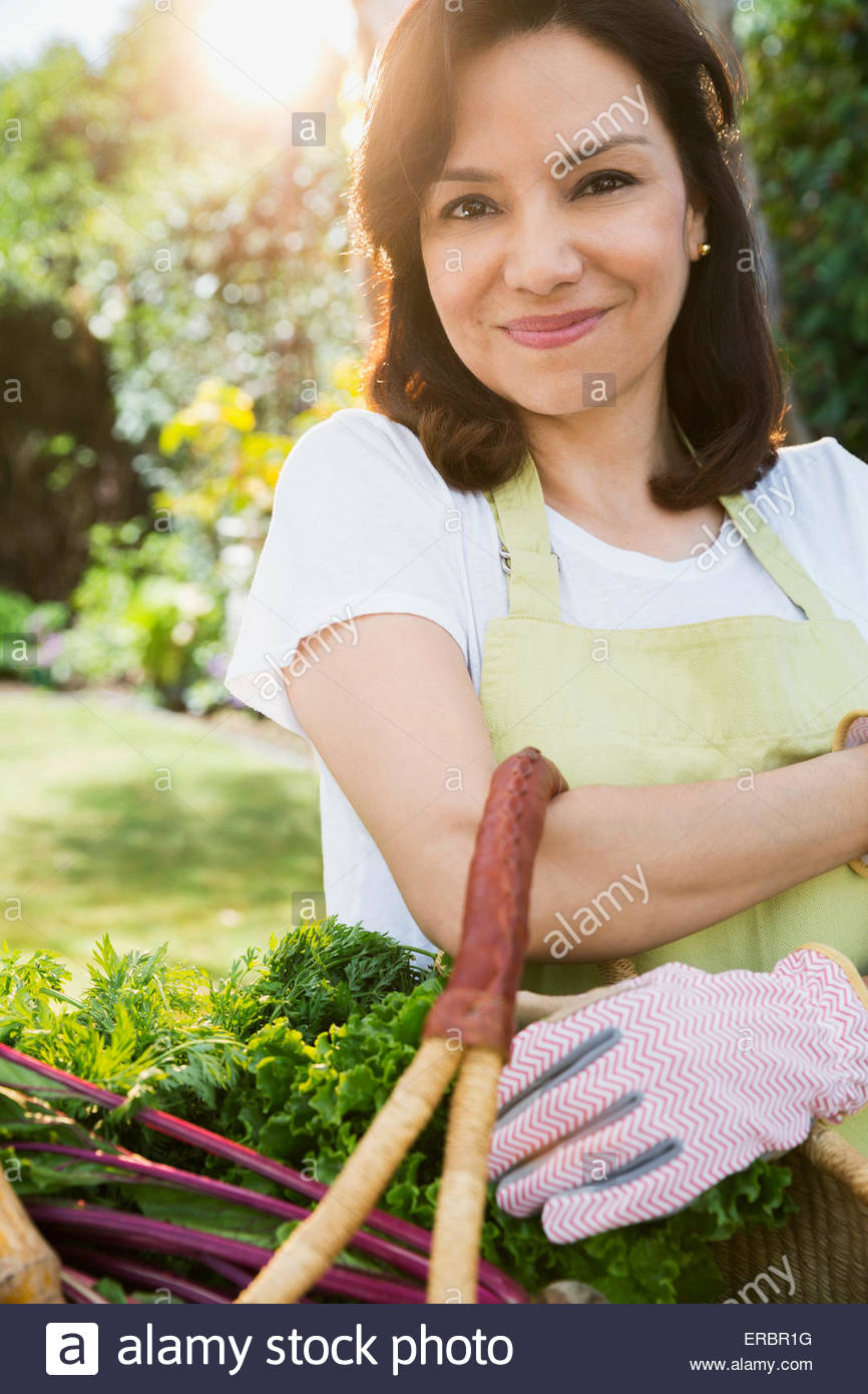 Woman harvesting vegetables hi-res stock photography and images - Alamy