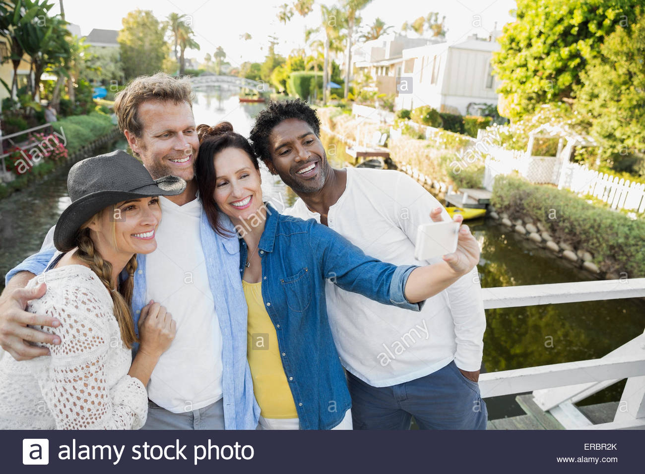 Four friends hugging hi-res stock photography and images - Alamy