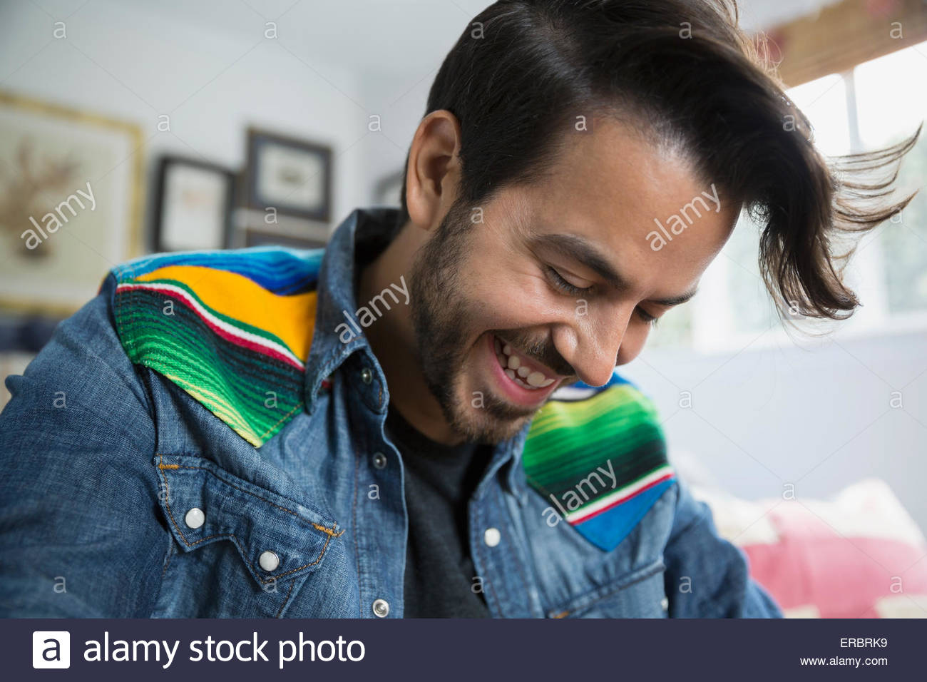 Portrait smiling brunette man looking down Stock Photo - Alamy