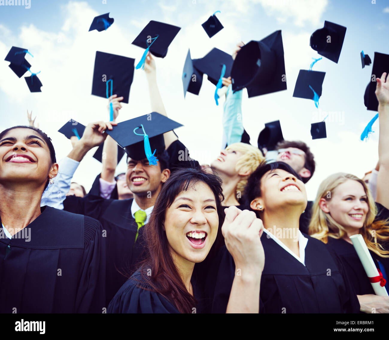 Graduation Caps Thrown in the Air Stock Photo - Alamy
