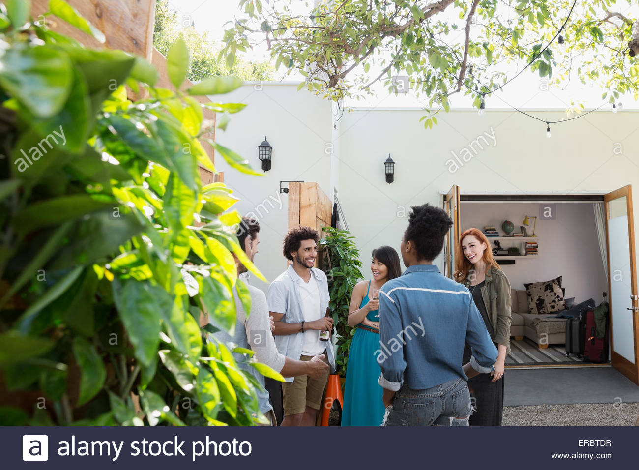 Friends drinking on patio hi-res stock photography and images - Alamy
