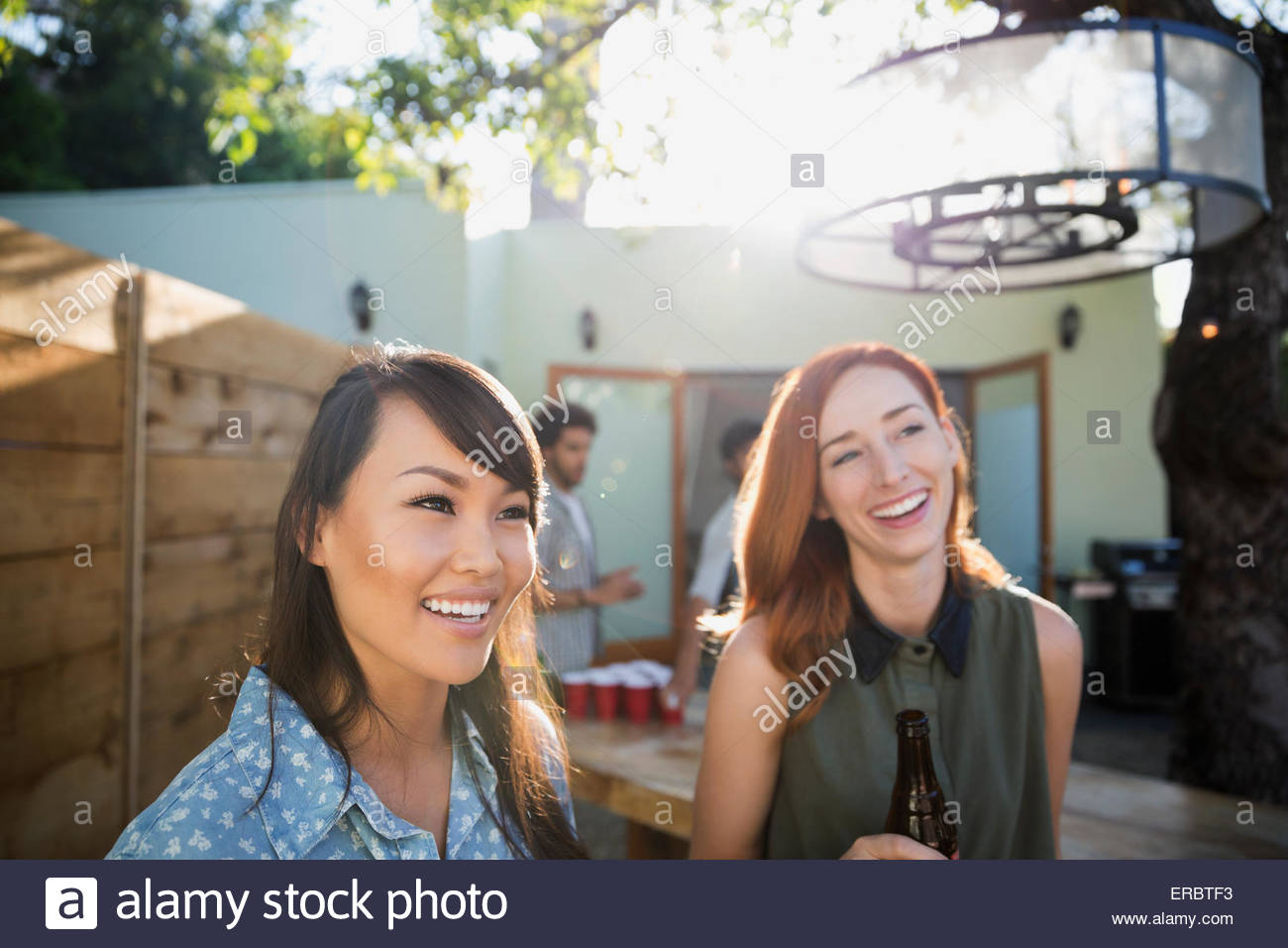 Friends drinking on patio hi-res stock photography and images - Alamy